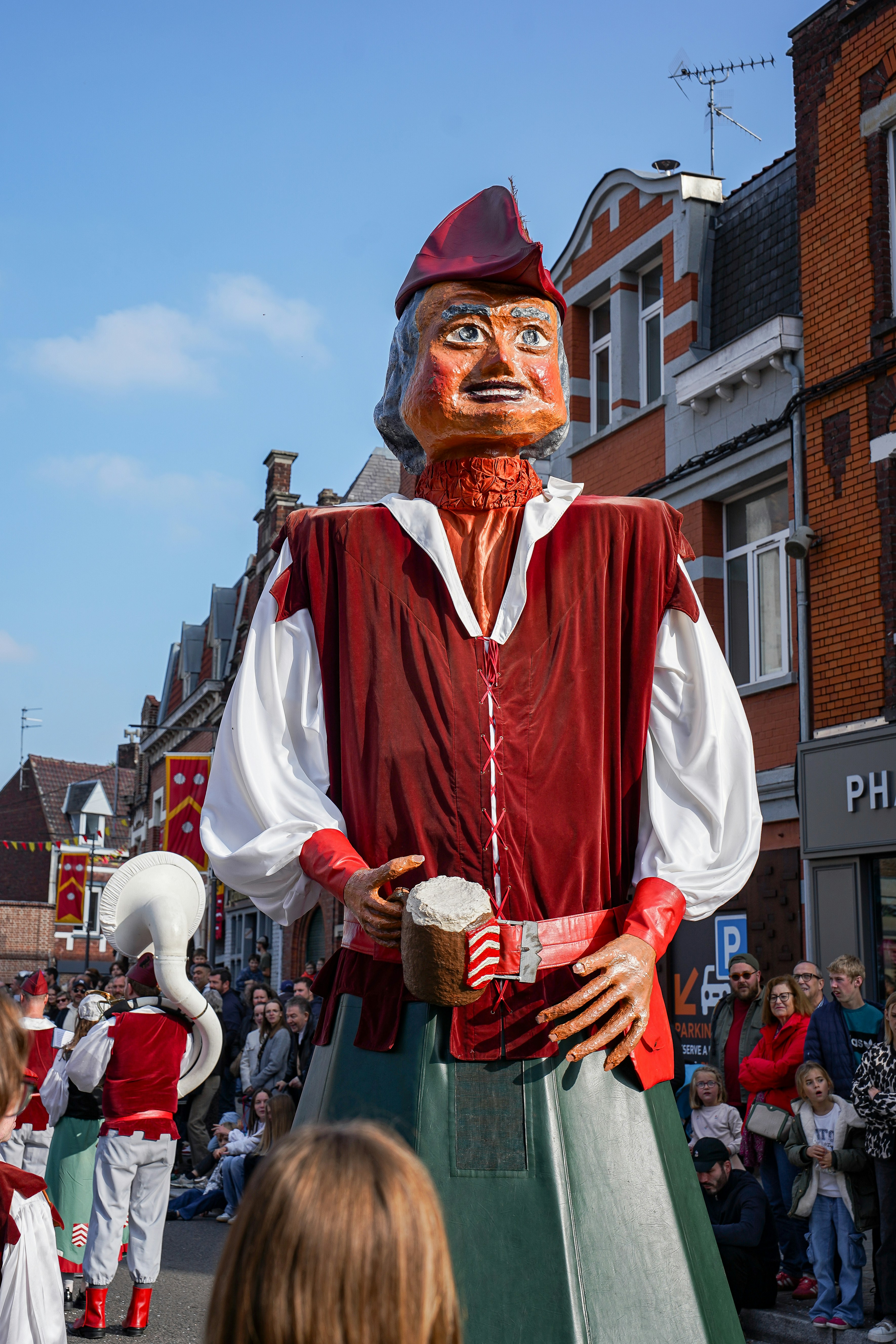 Giant Parade Figurine Dominates a Sunlit Street