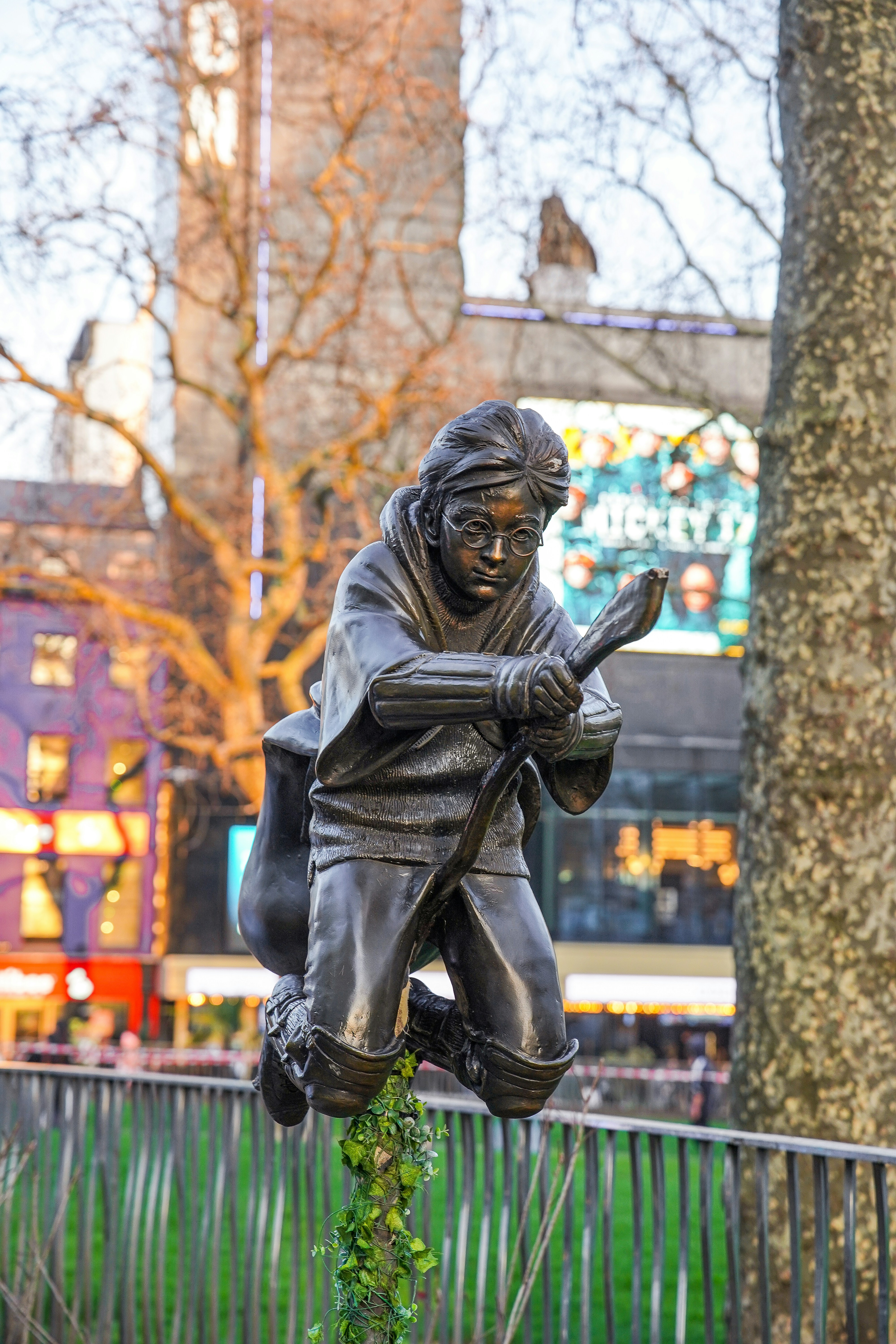 Hero in Bronze: A Firefighter Statue Leaping Toward the Street
