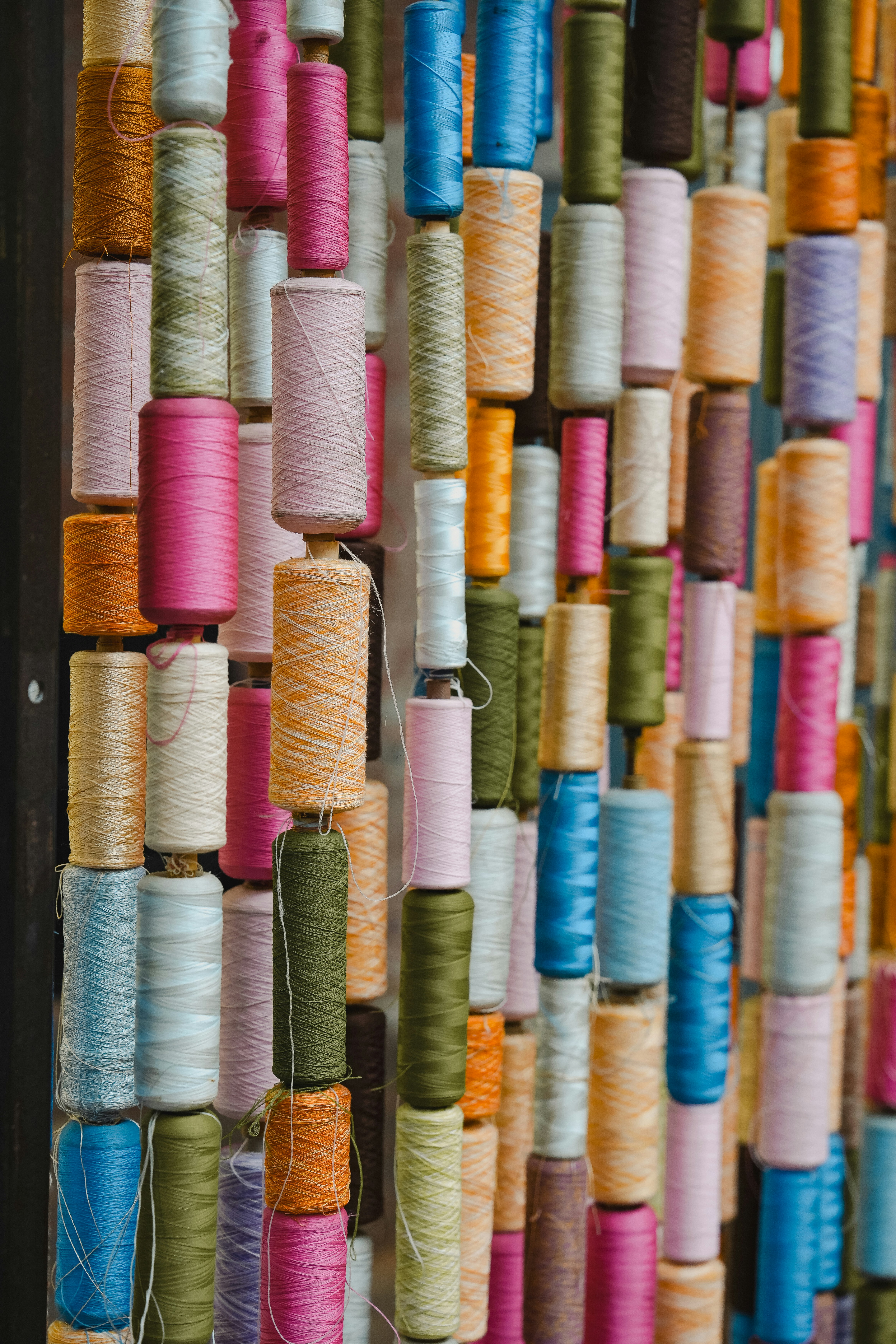 Threads of Color: A Mosaic of Spools in Evening Light