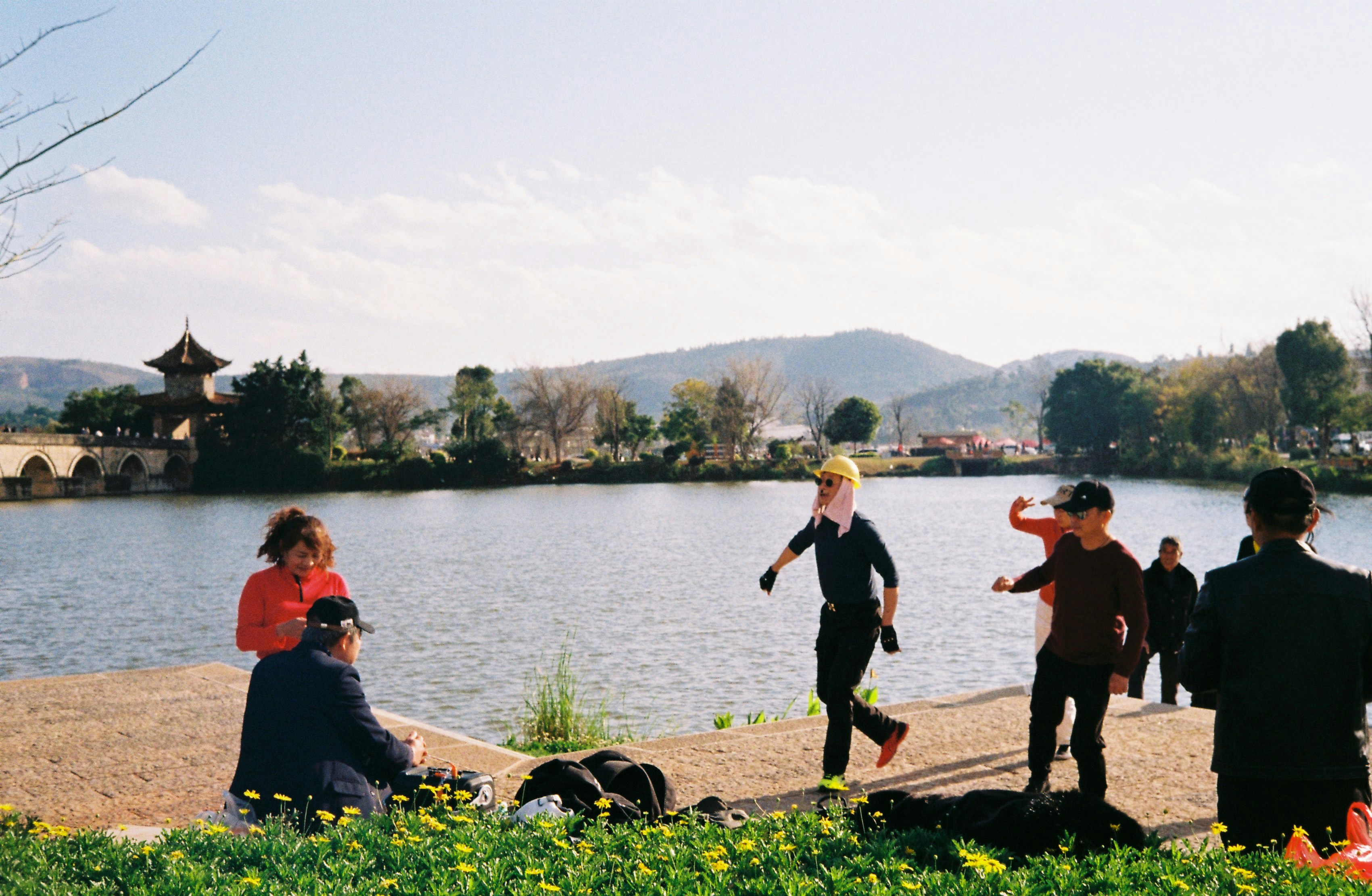 Lakeside Stroll: A Quiet Moment Among Sunday Friends