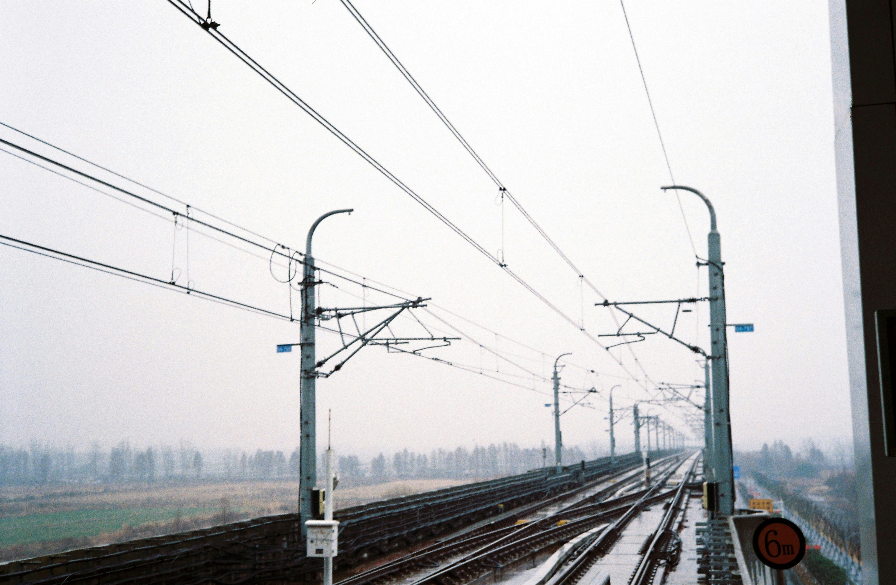 Tracks to the Horizon: Parallel Rails under Overcast Skies