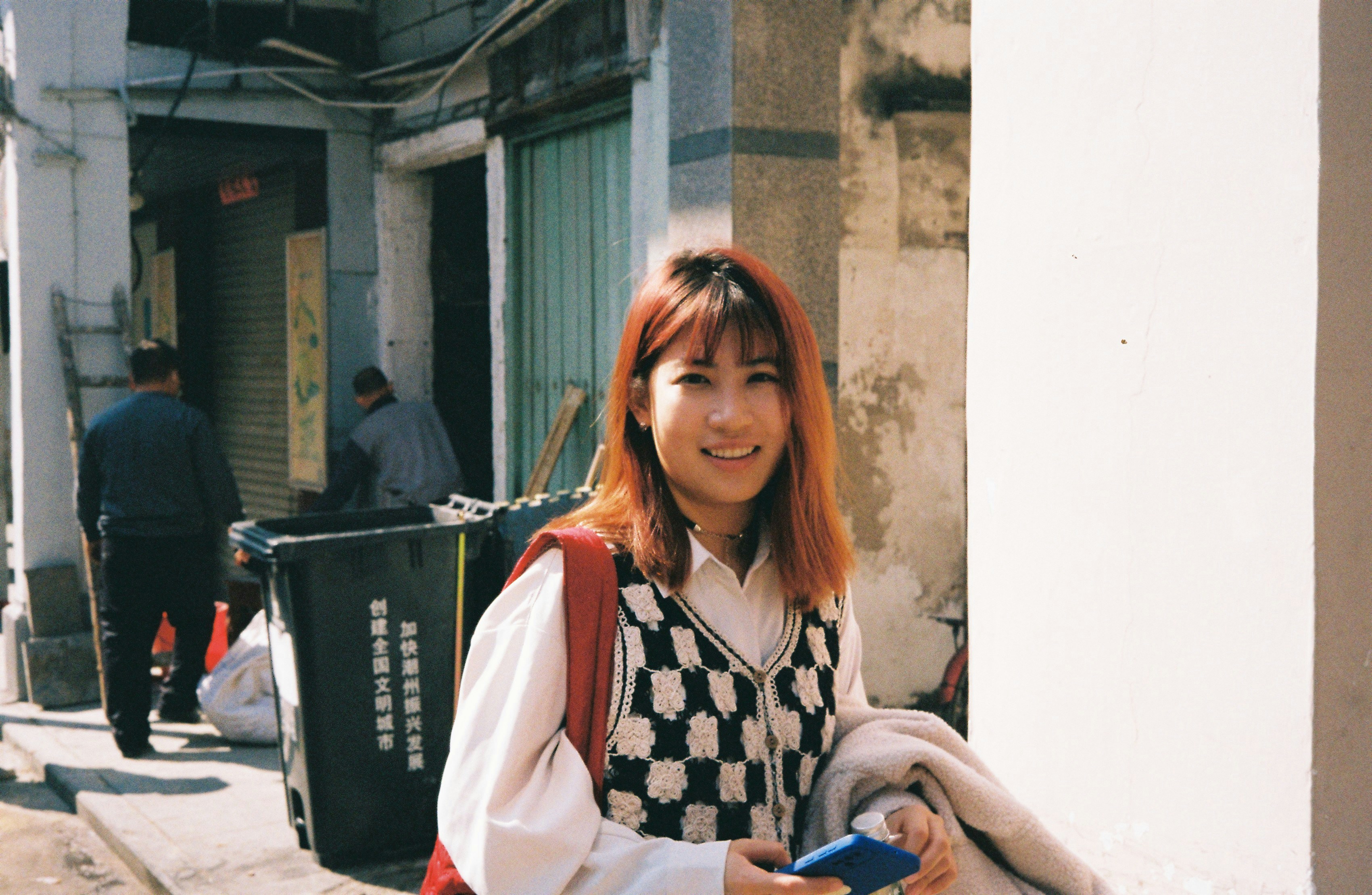 Portrait in the Alley: A Sunlit Moment with a Cheerful Smile