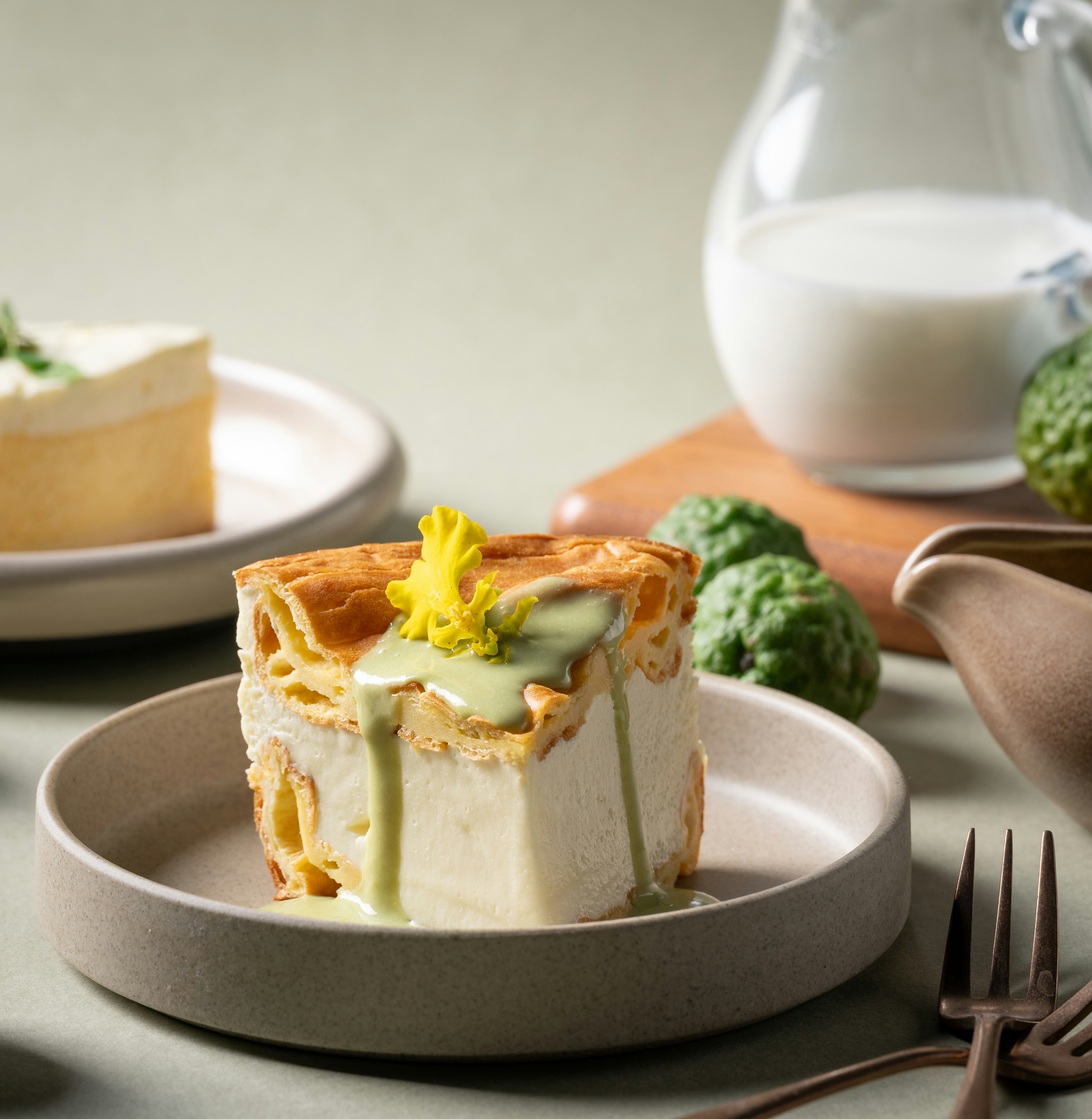Creamy Cheesecake with Green Tea Drizzle and a Yellow Floral Accent