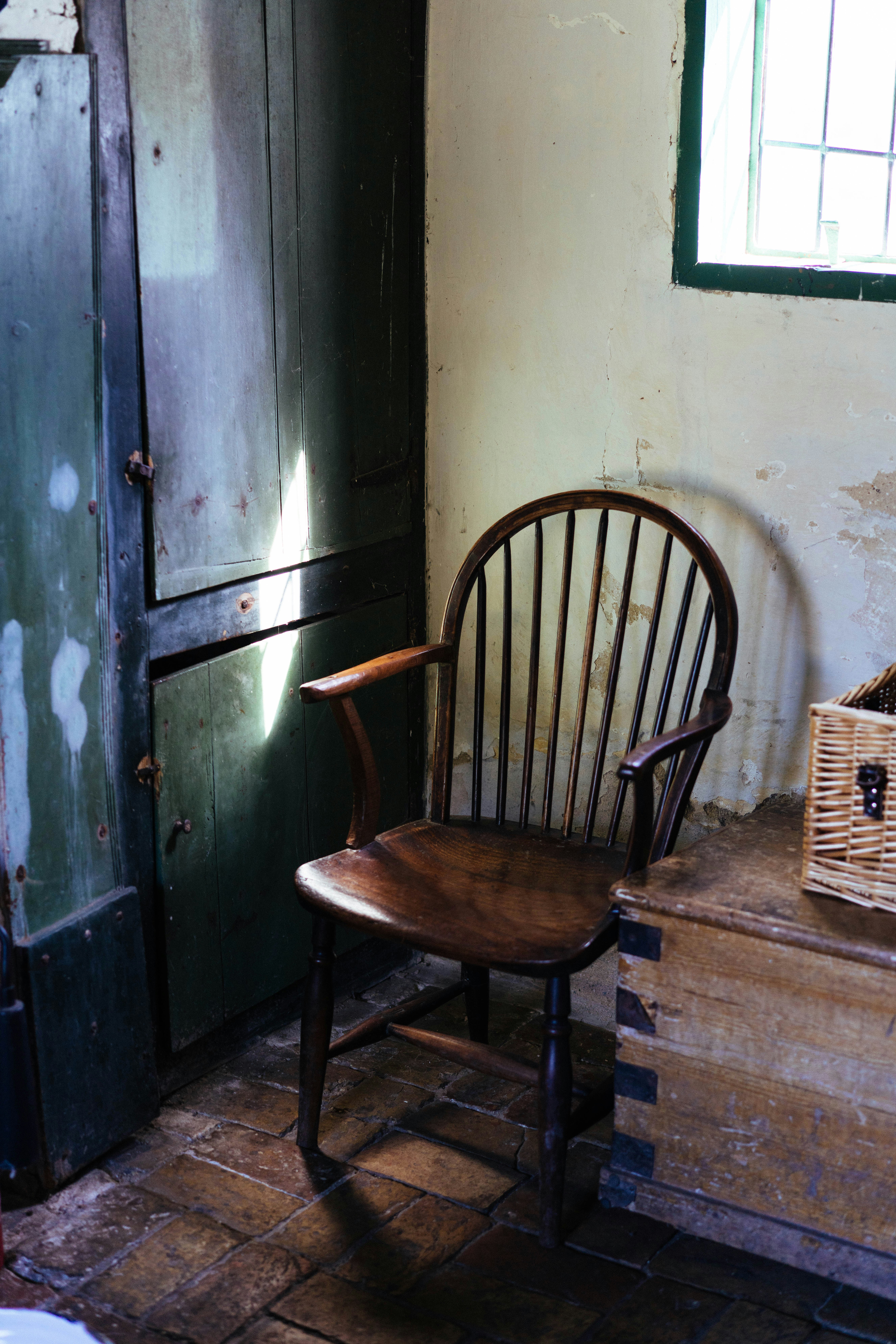 Dusty Wooden Chair in Softly Lit Corner