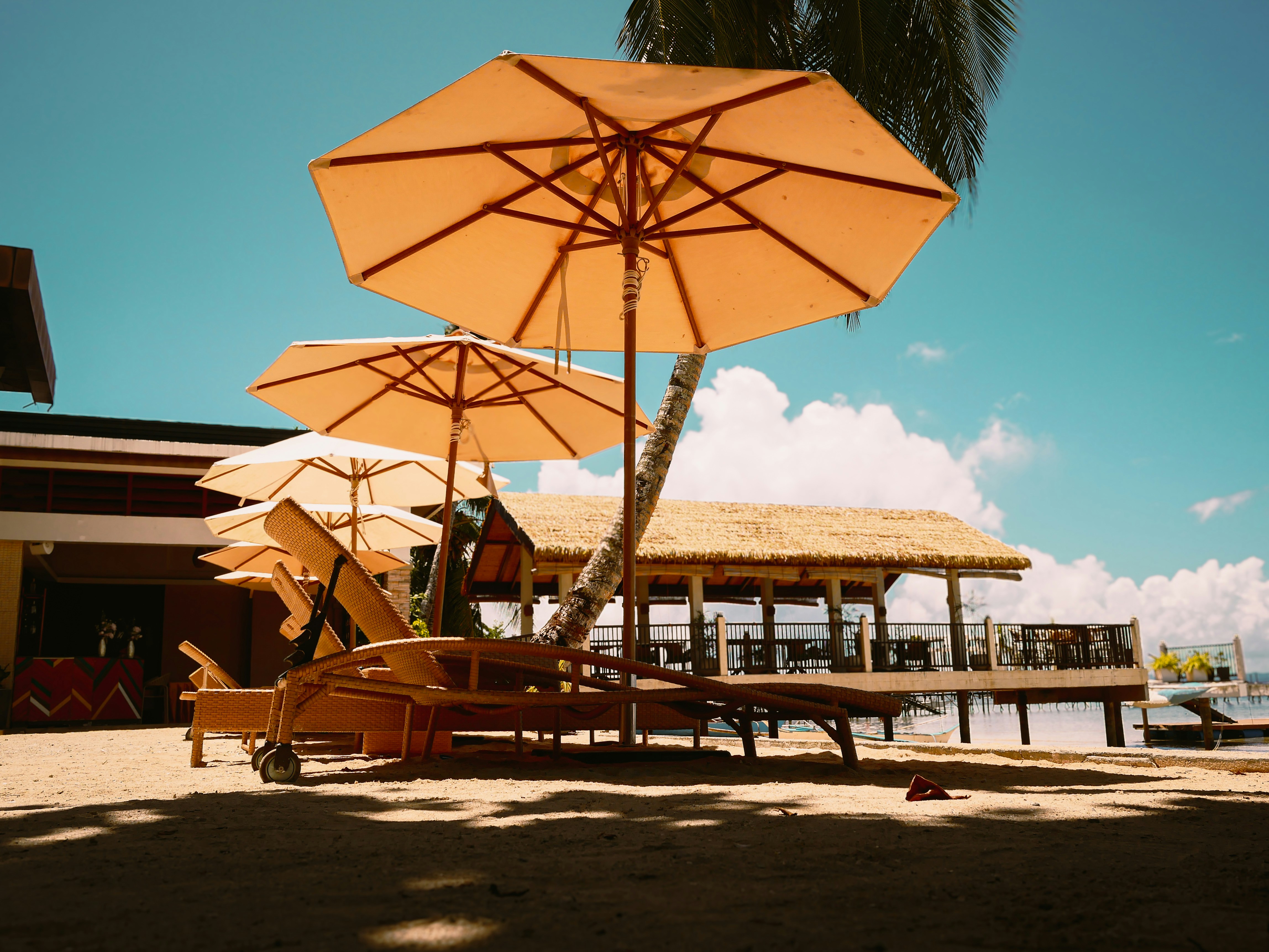 Orange Parasol Over the Quiet Beach Terrace