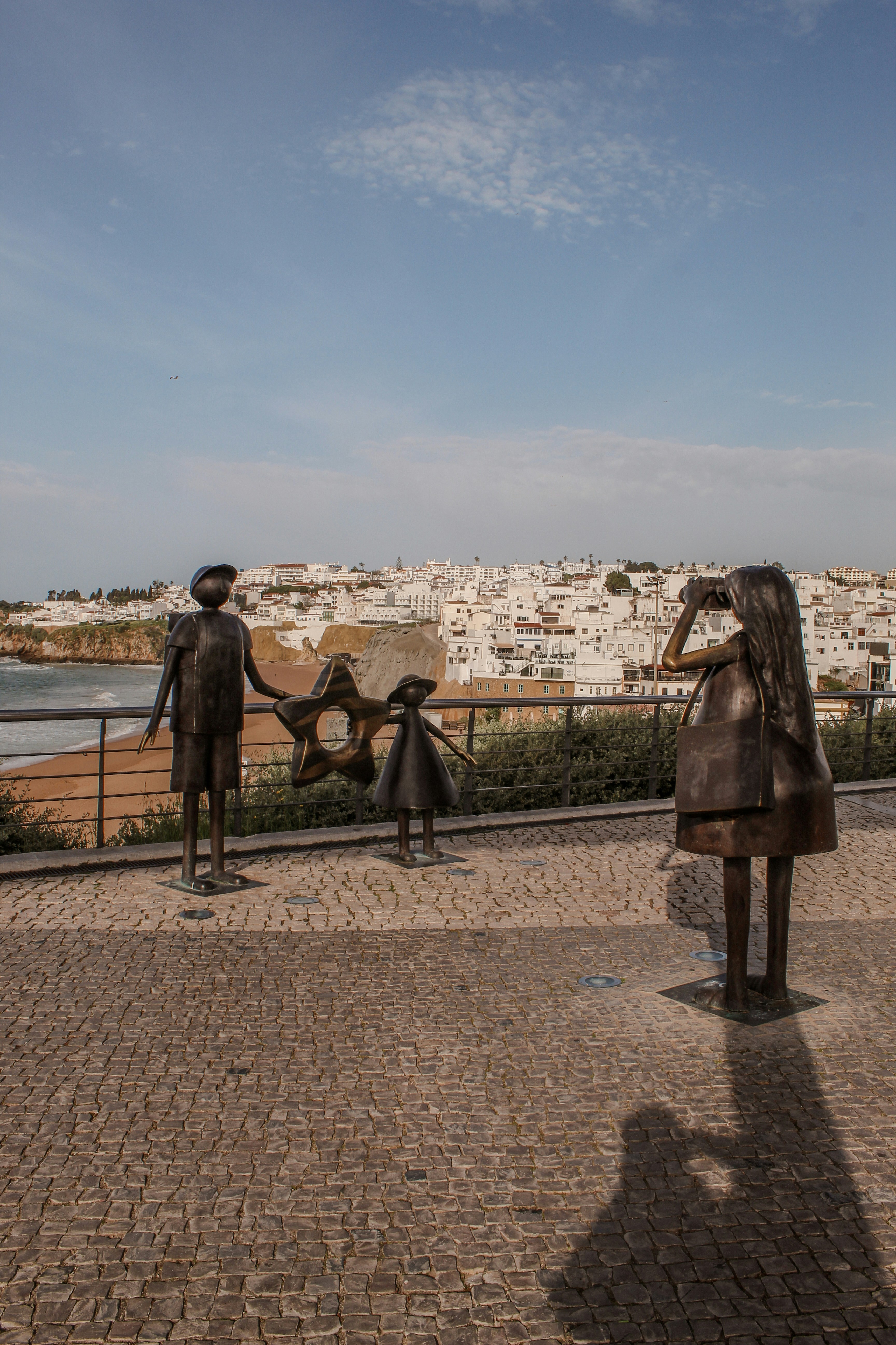 Bronze Figures at the Edge of the City