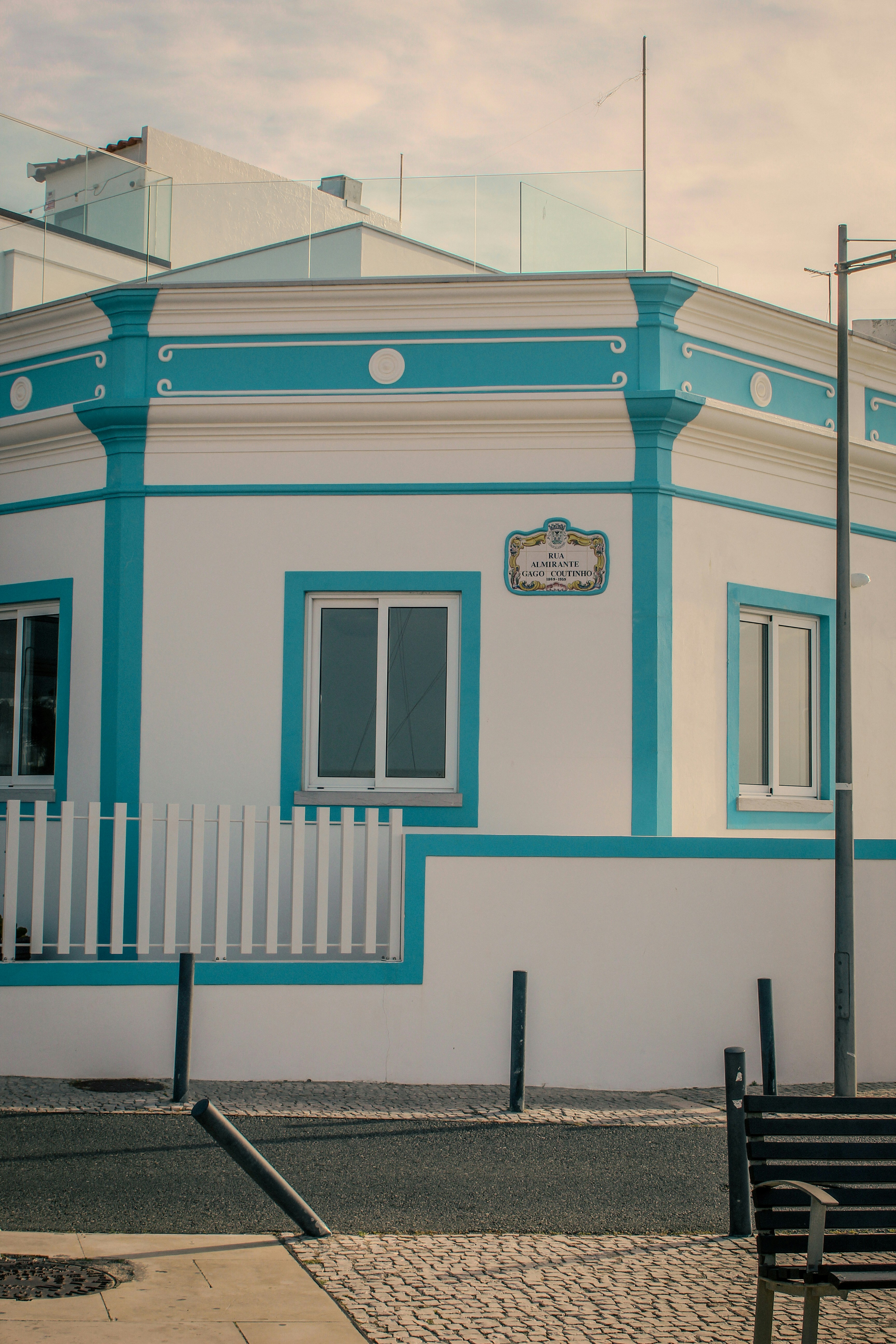 Blue Trim and White Facade: The Corner House by the Street