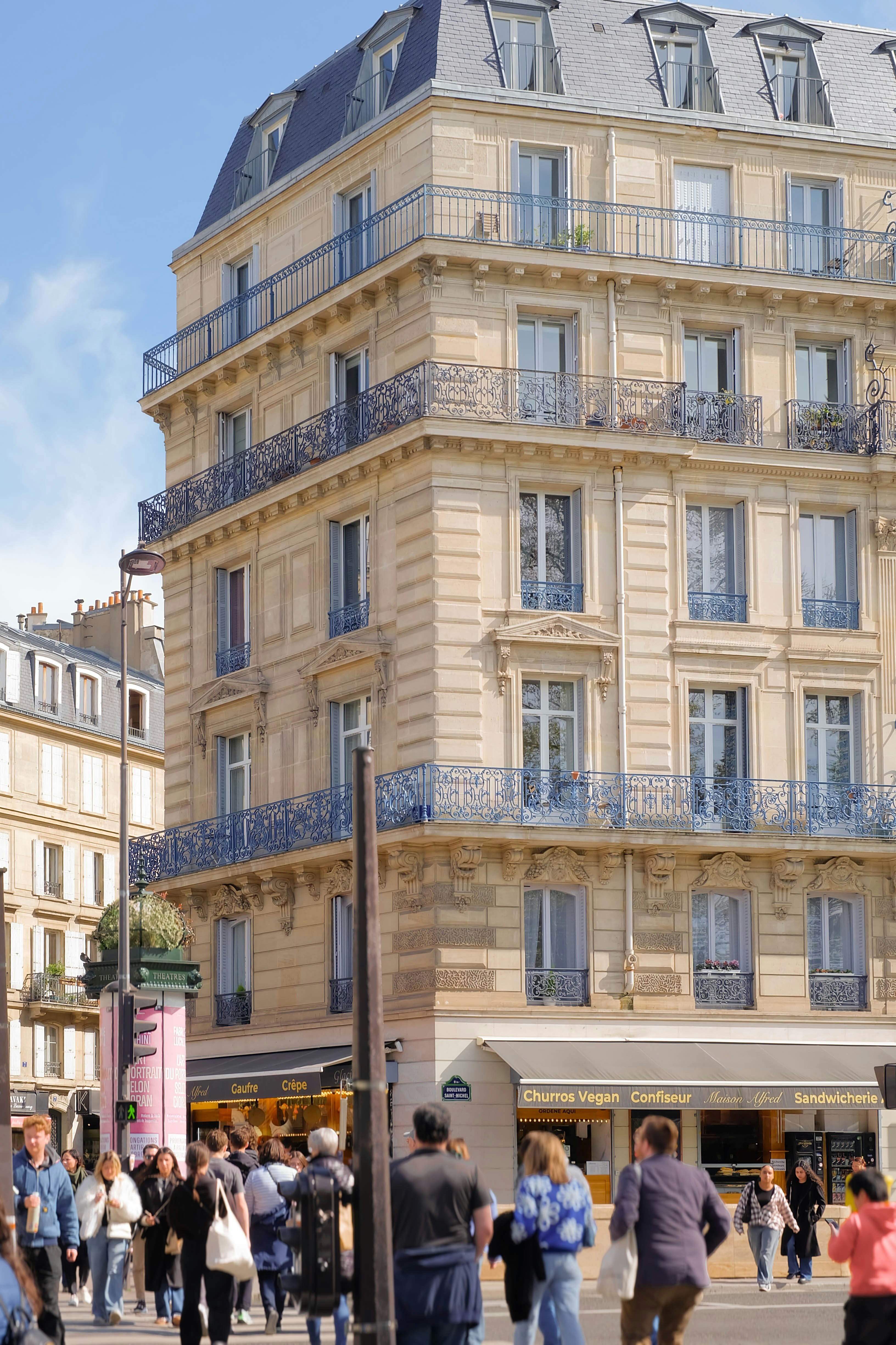 Corner Bloom: A Parisian Façade Overlooking a Busy Boulevard