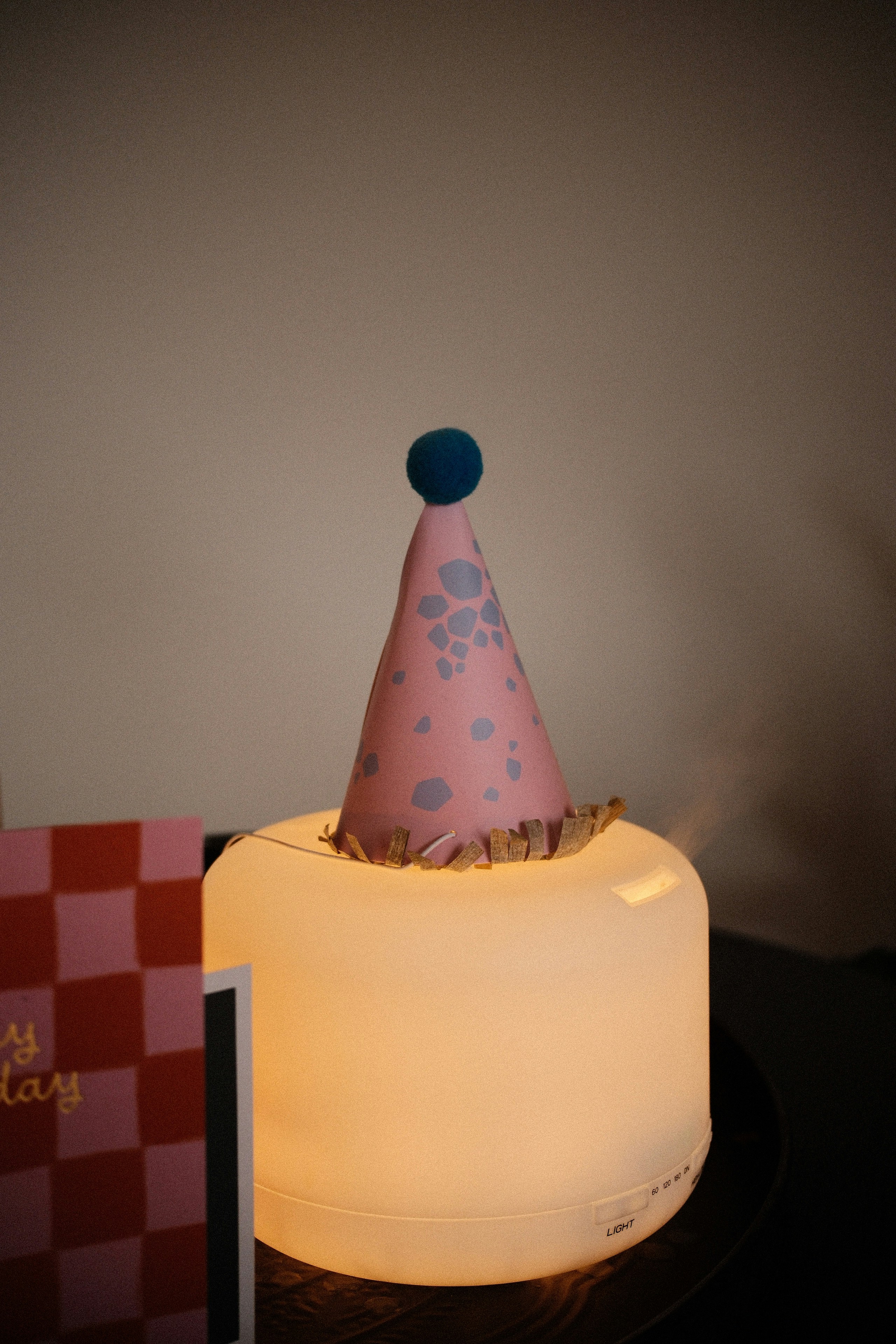 Birthday Candle Spotlight: A Solo Party Hat on a Cozy Cake