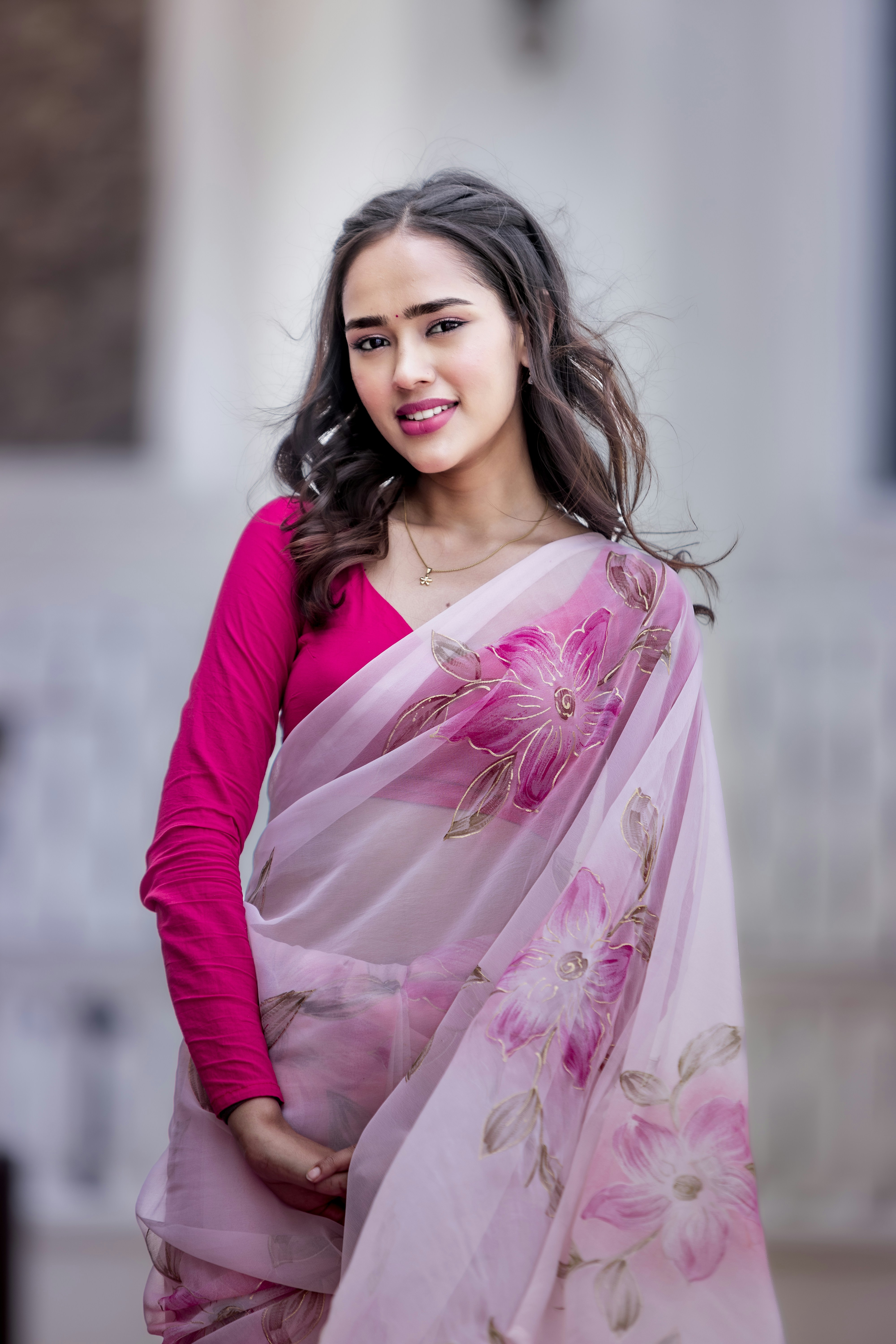 Graceful Poise in Pink: A Portrait in Floral Veil