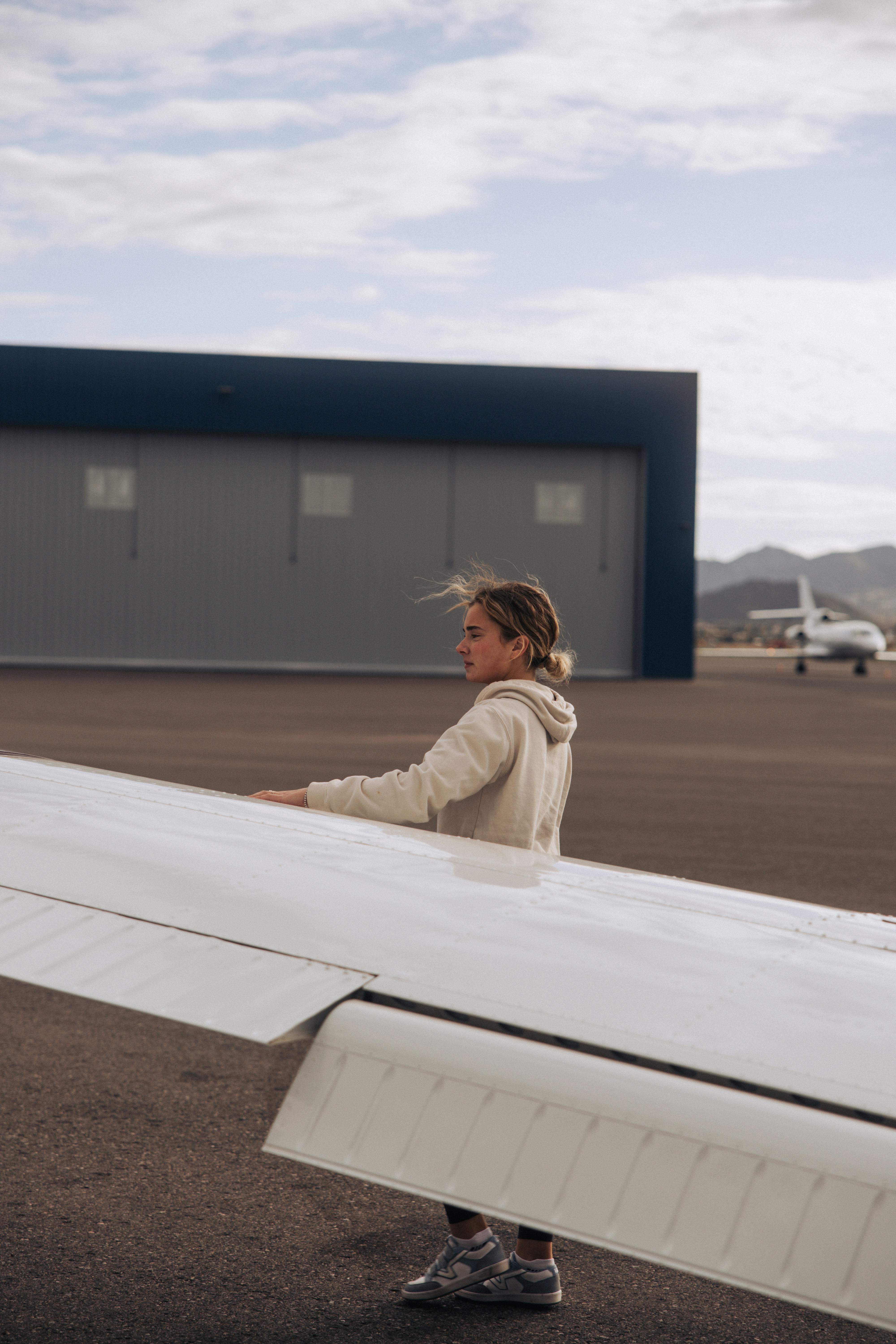 Winged Presence: A Quiet Moment by the Tarmac