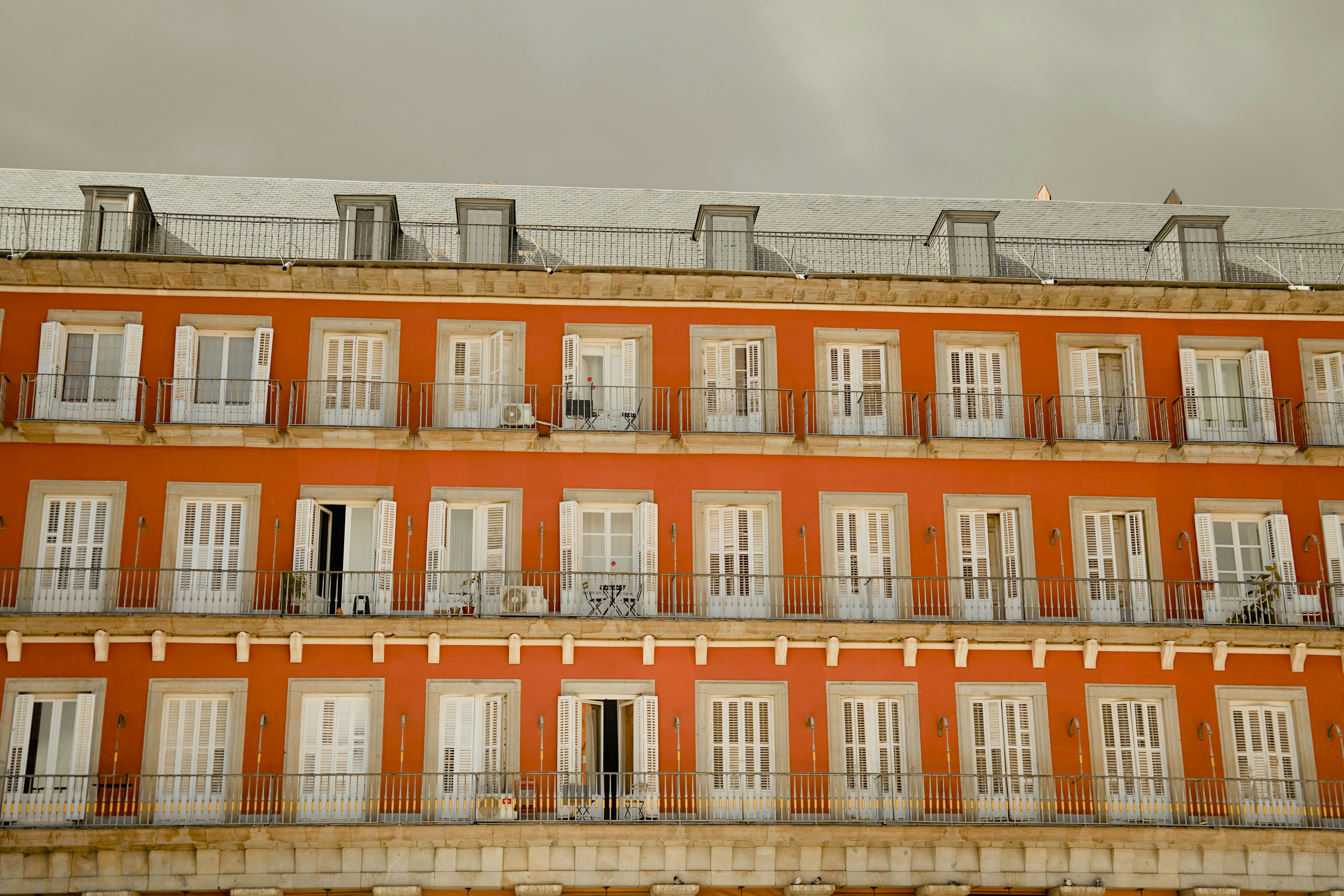 Red Facade of a Courtyard Villa: Repetition and Rhythm Across Levels