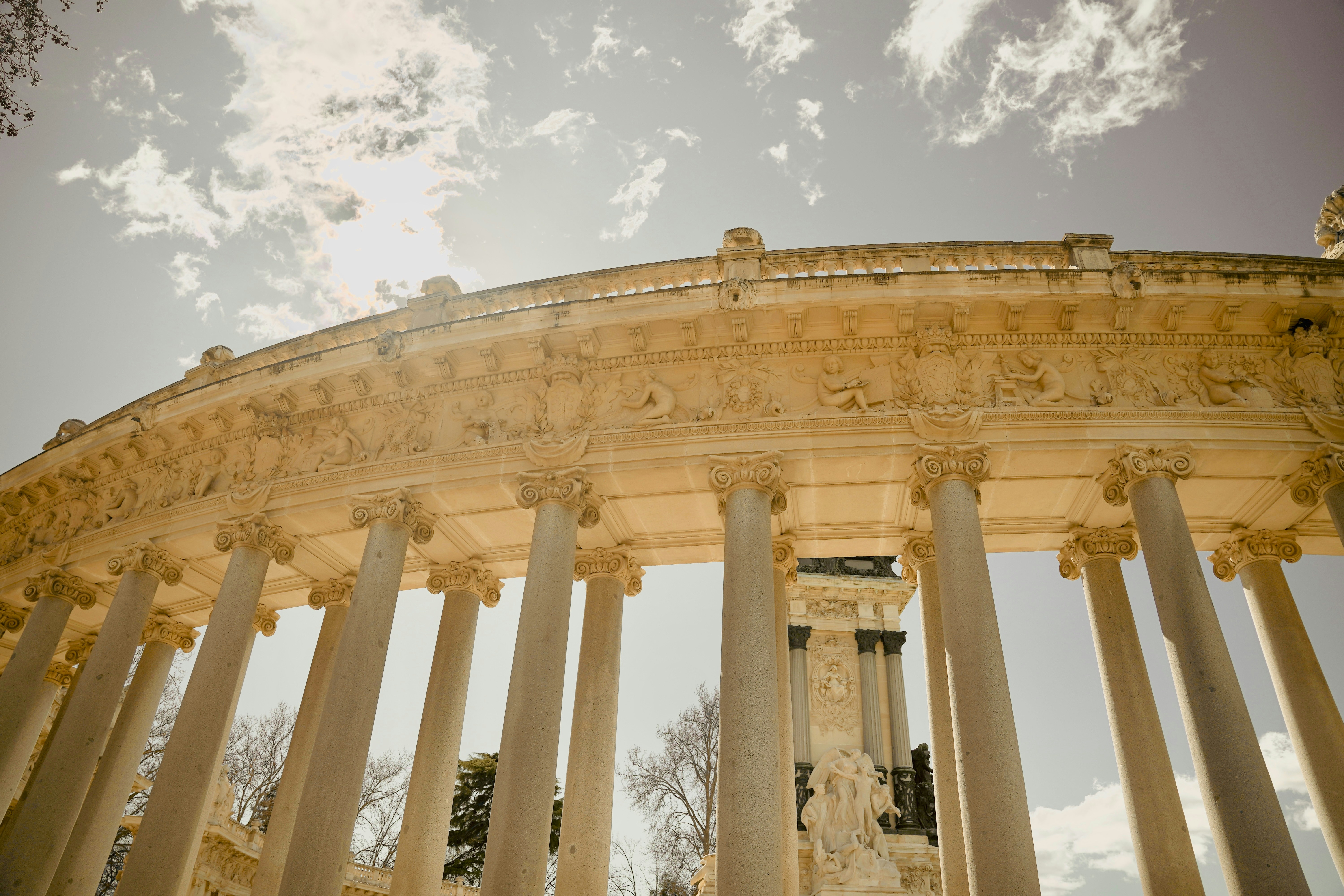 Sunlit Parapets: A Low-Angle View under Ancient Colonnades