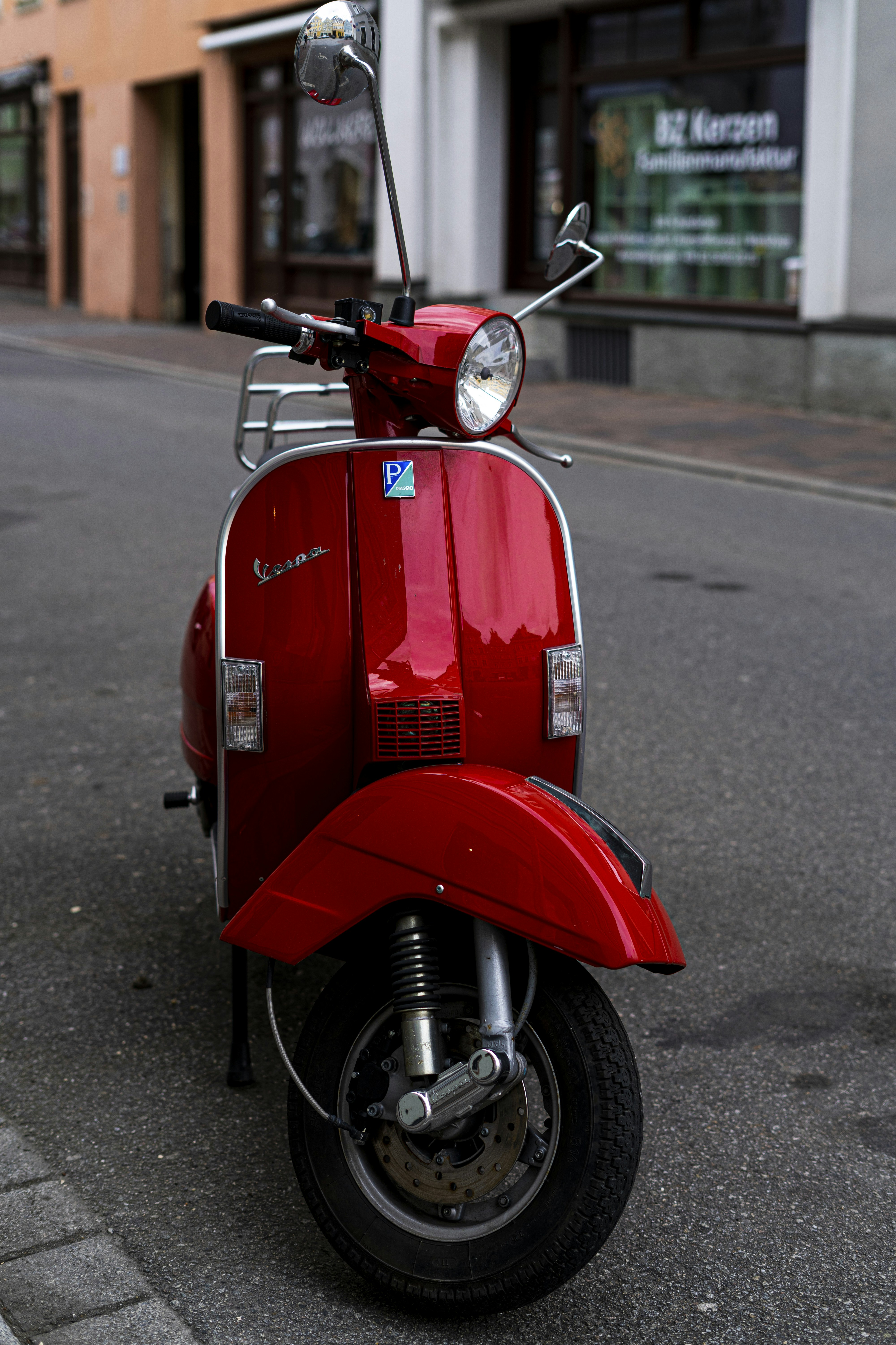 Red Vespa on a Quiet Street: A Portrait of Italian Flair