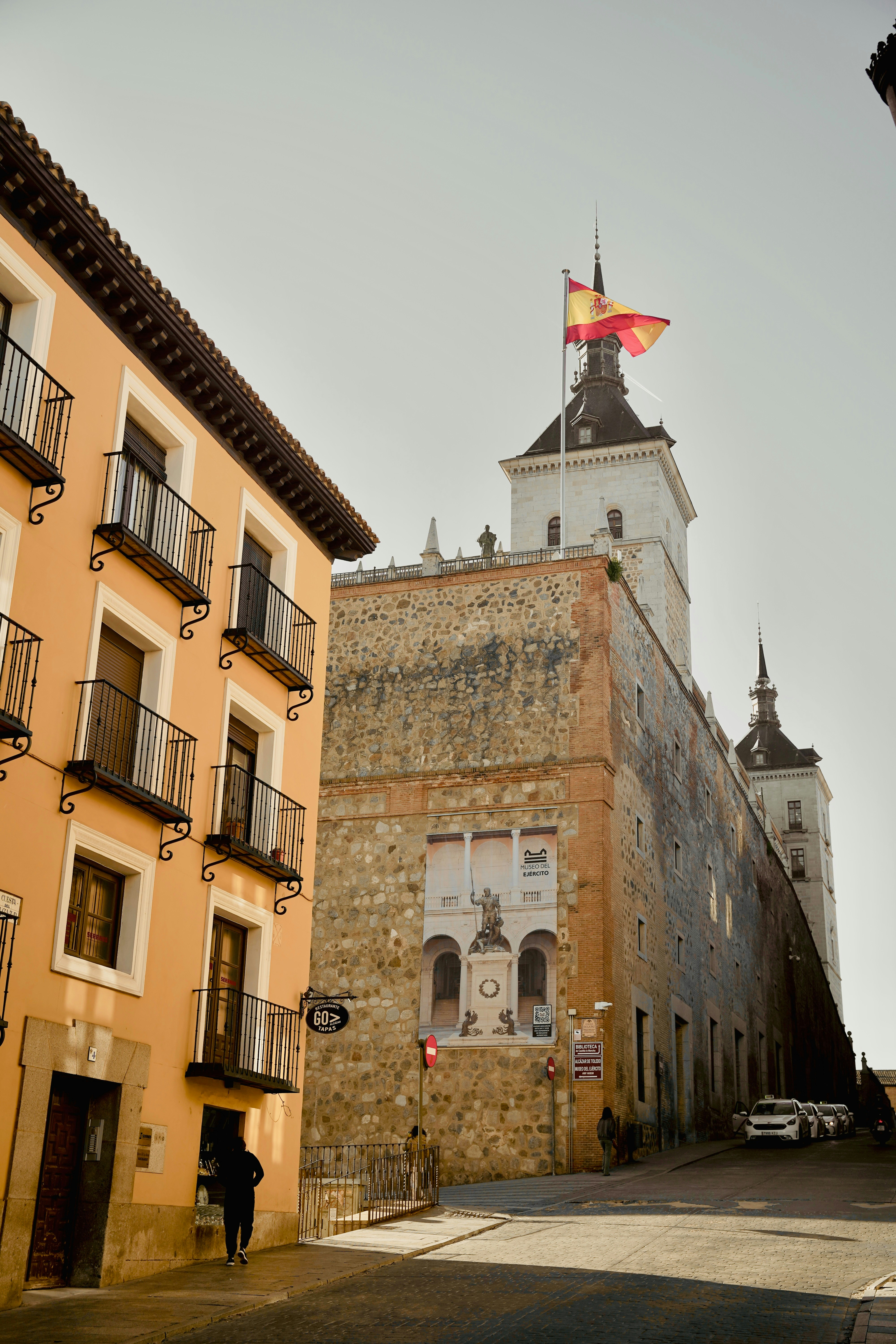 Gatehouse and Flag: A Sunlit Calle of Stone and Sand