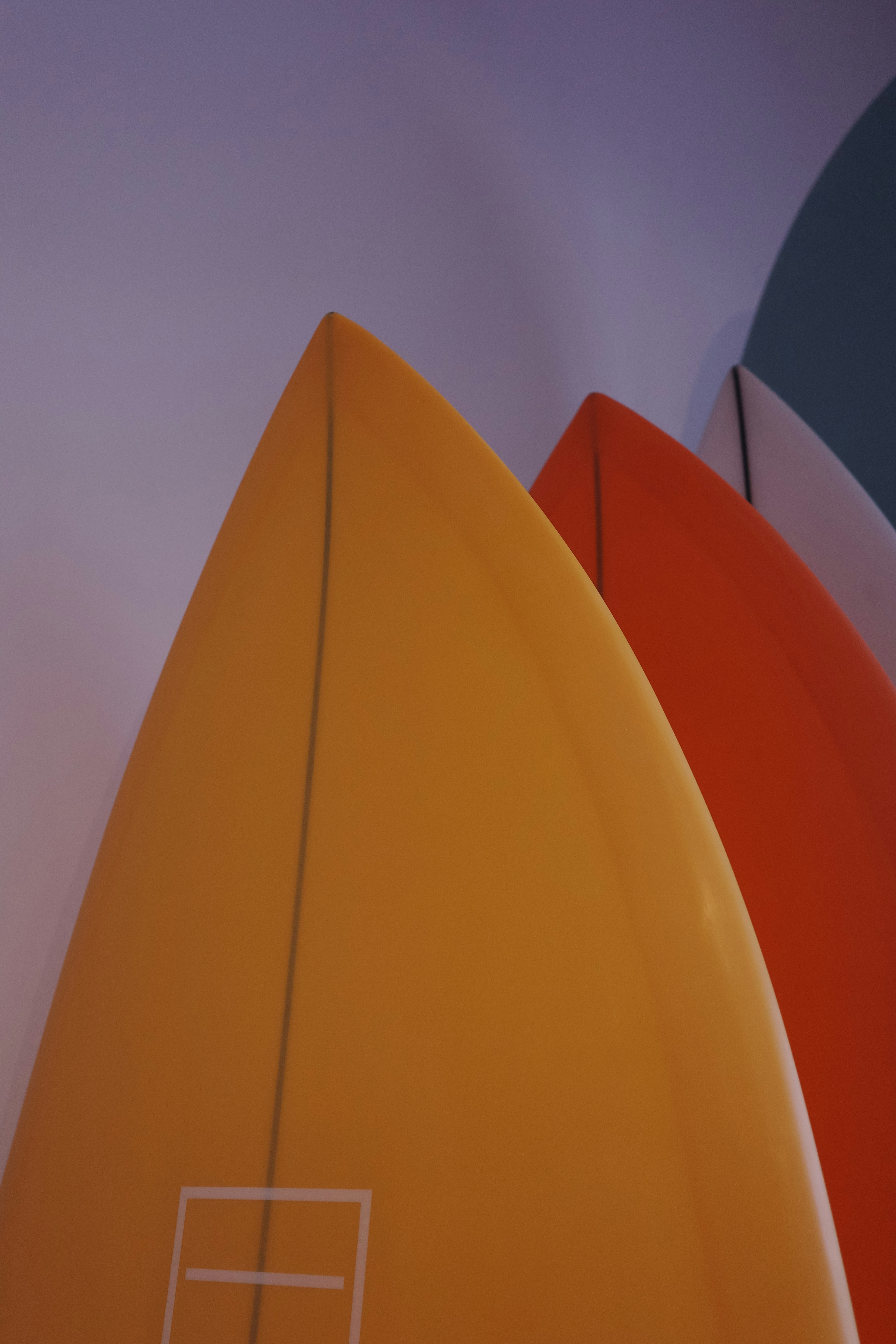 Colorful Surfboard Fragments Leaning in Quiet Light