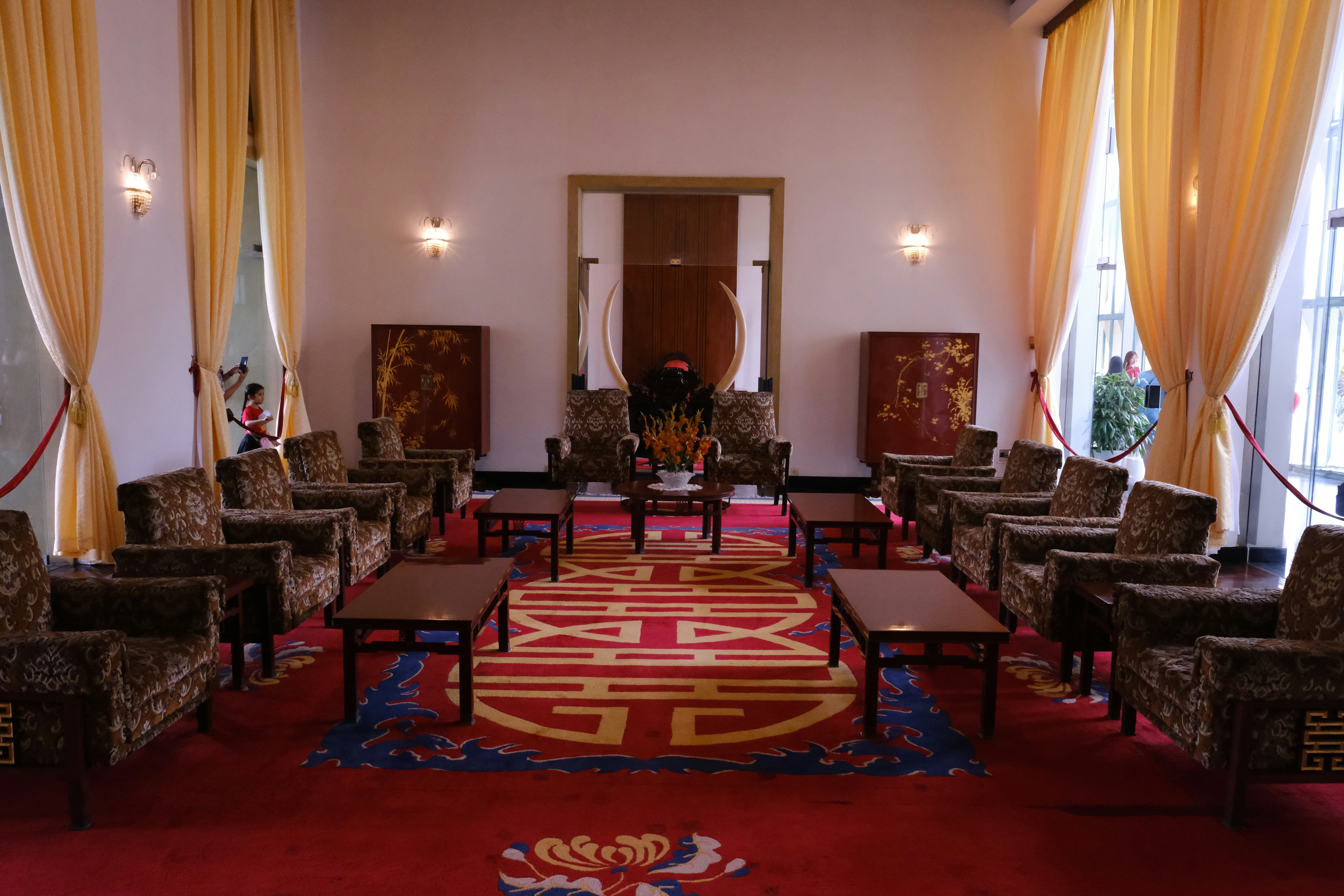 Regal Lounge with Sunlit Draperies and Central Fireplace