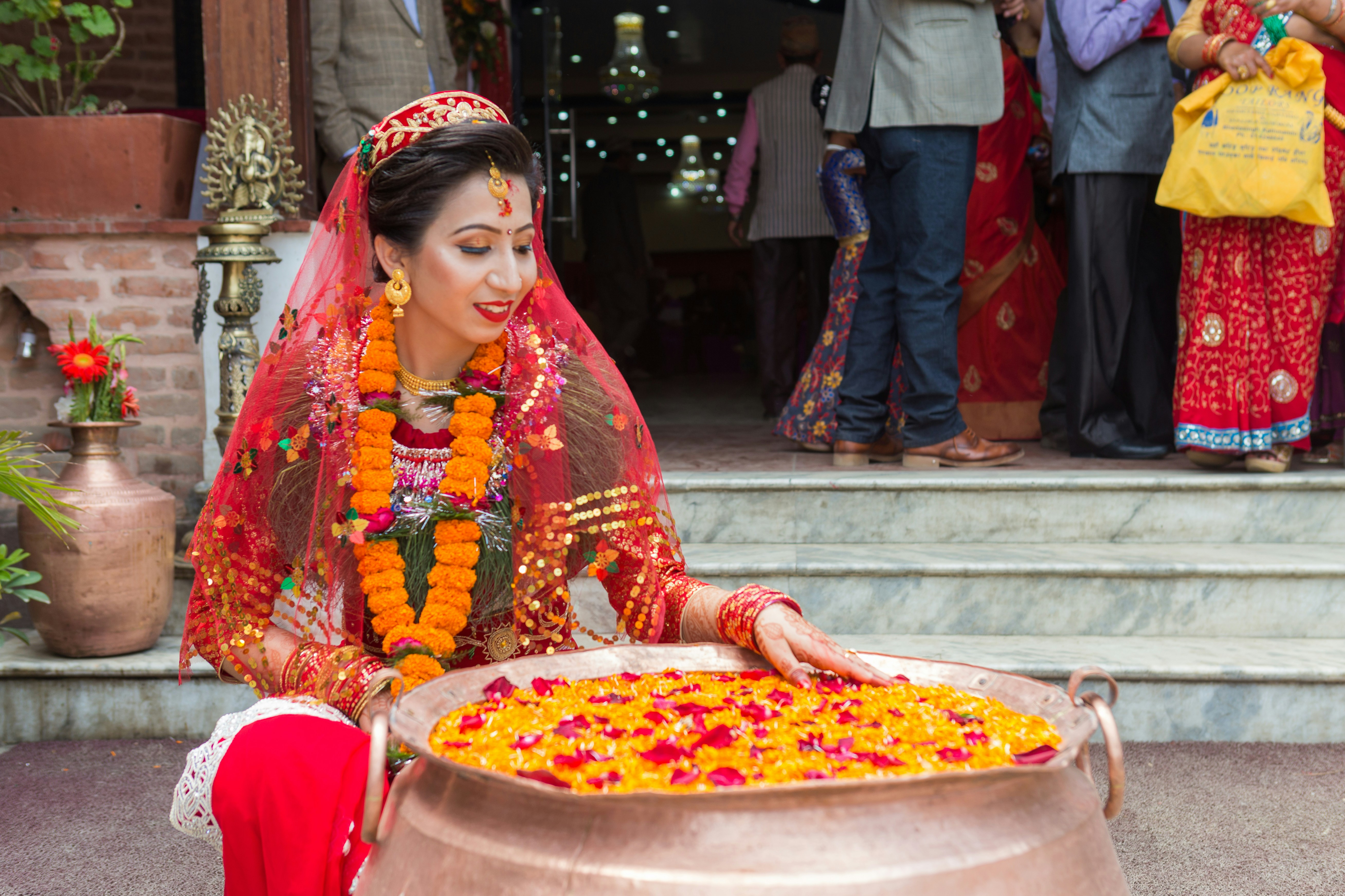 Bride in petals: a ceremonial scene at the doorway