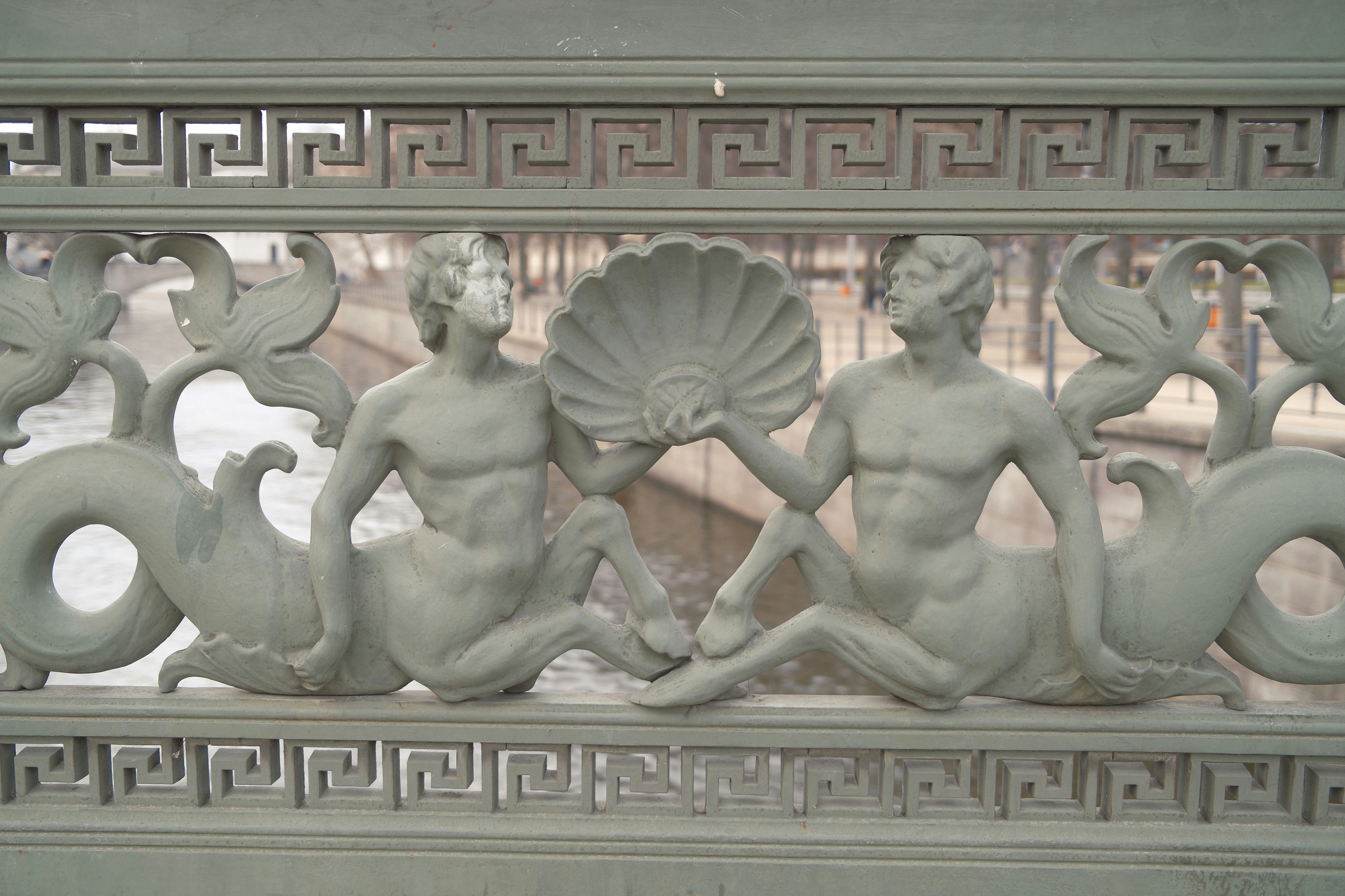 Sea-Harped Guardians: A Stone Carved Moment of Balance