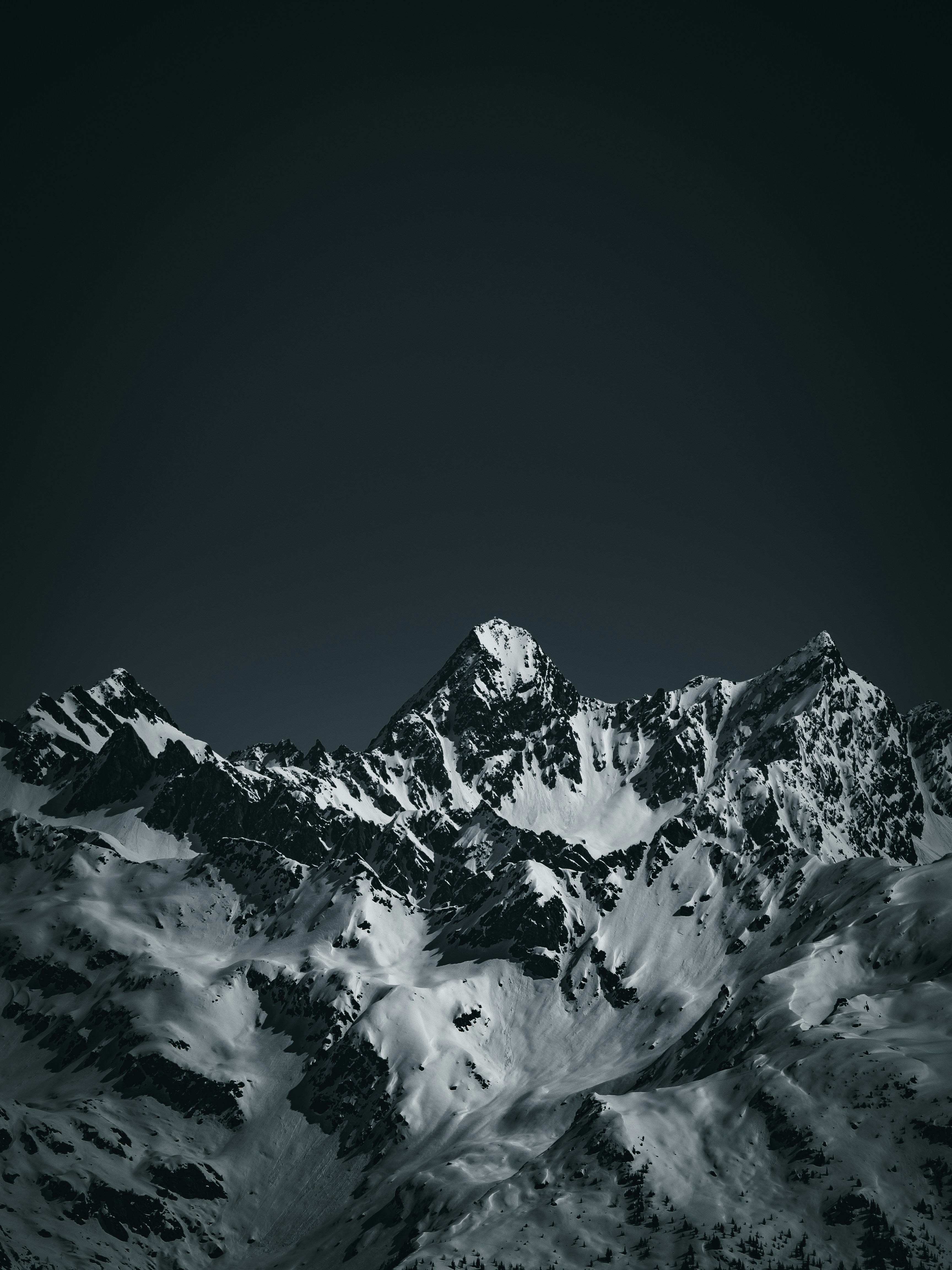 Winter Crown: Snow-etched Peaks Beneath a Velvet Sky