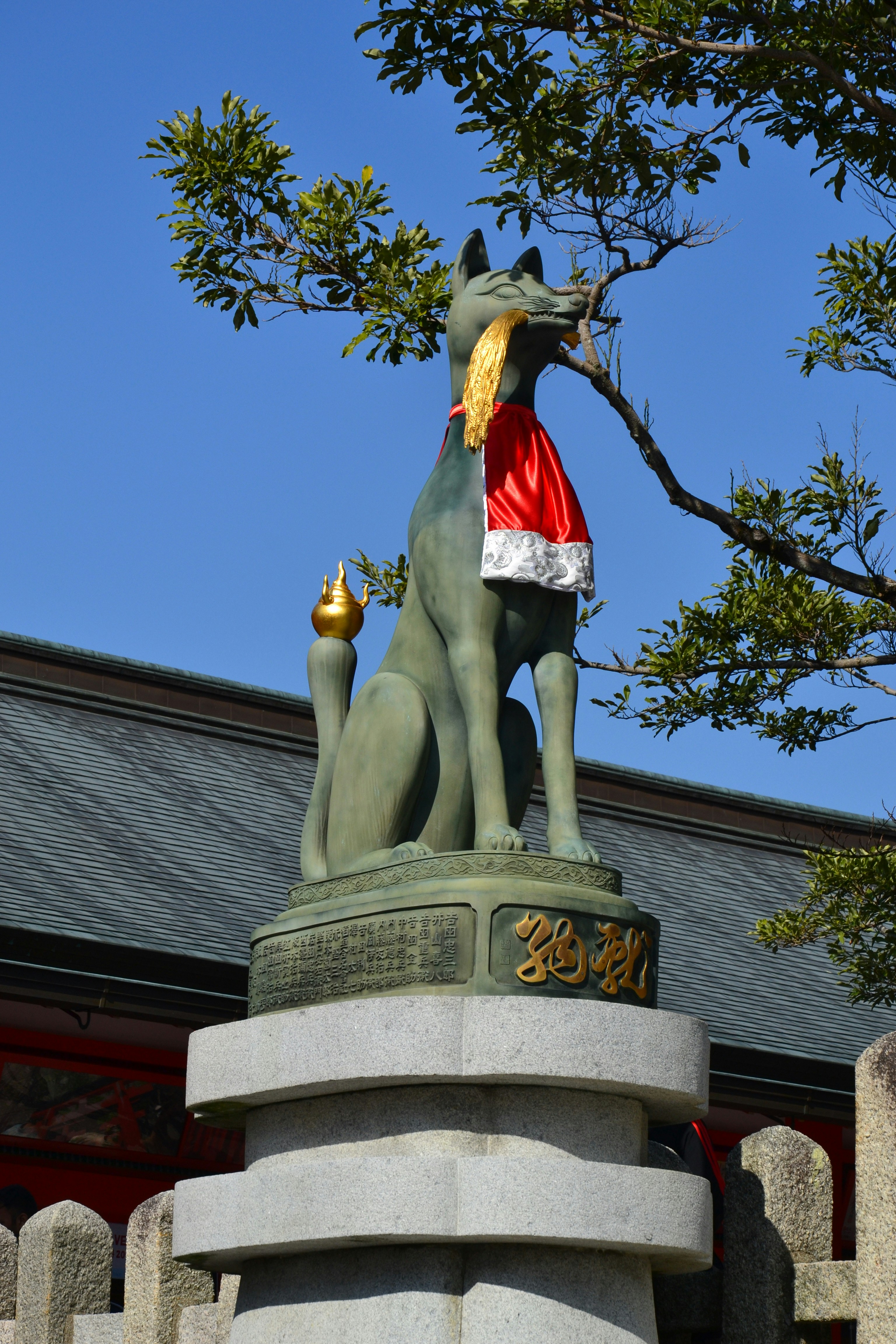 Guard Wolf Statue in Red Cape Underclear Blue Sky