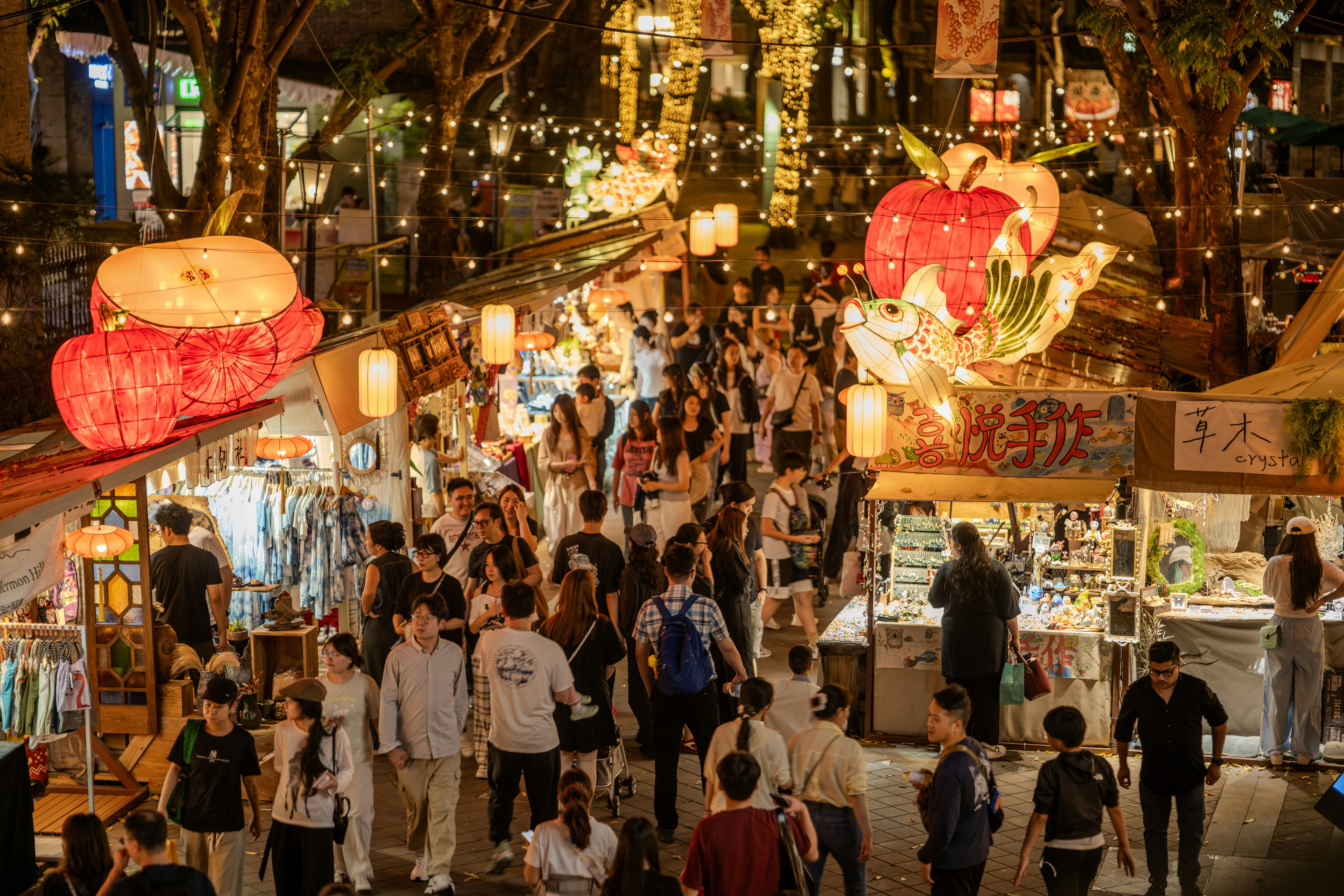 Lantern-lit Alleyway of Lanterns: Night Market Crowds in Focus