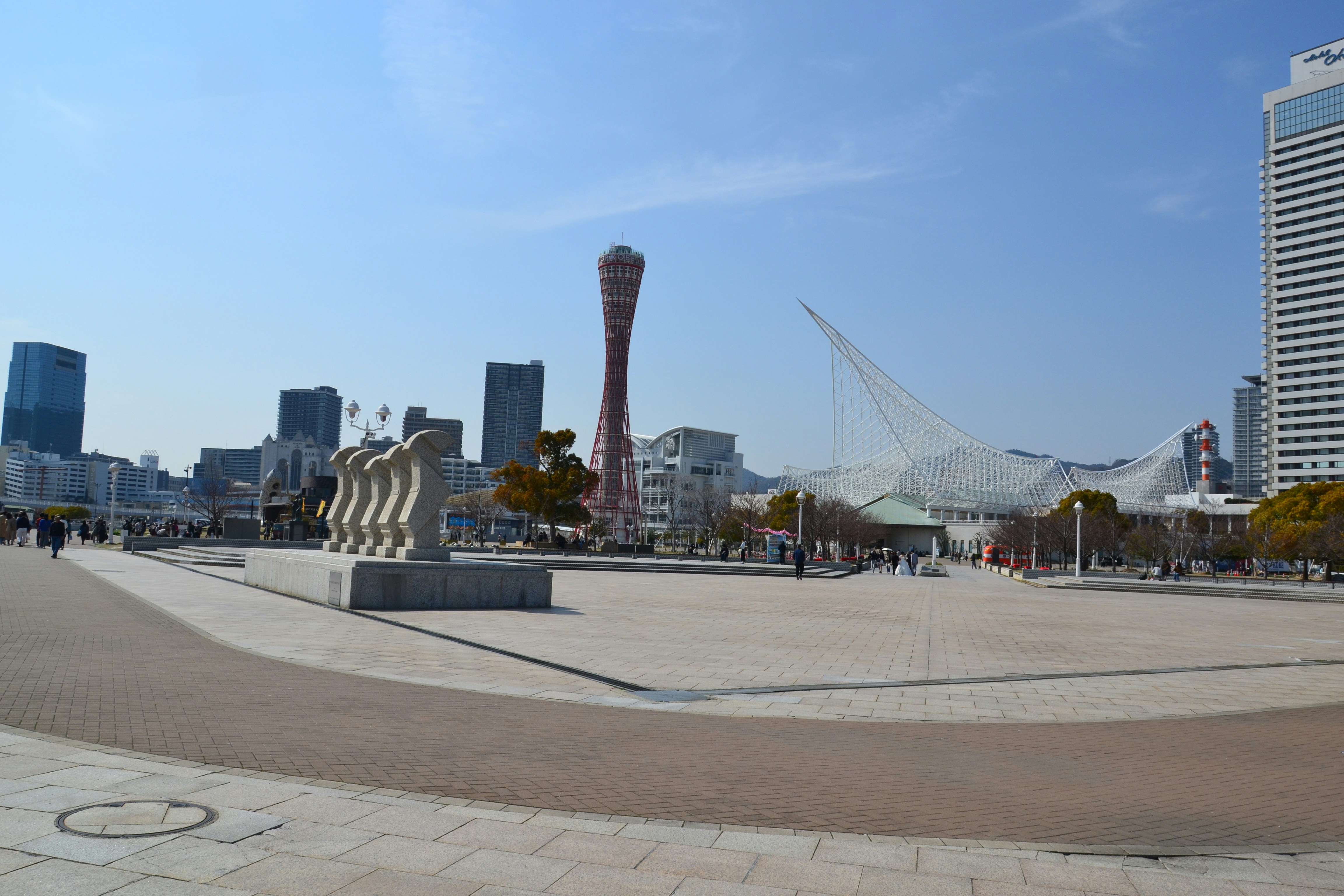City Plaza Panorama: Modern Sculptures Meet Shaped Skyline