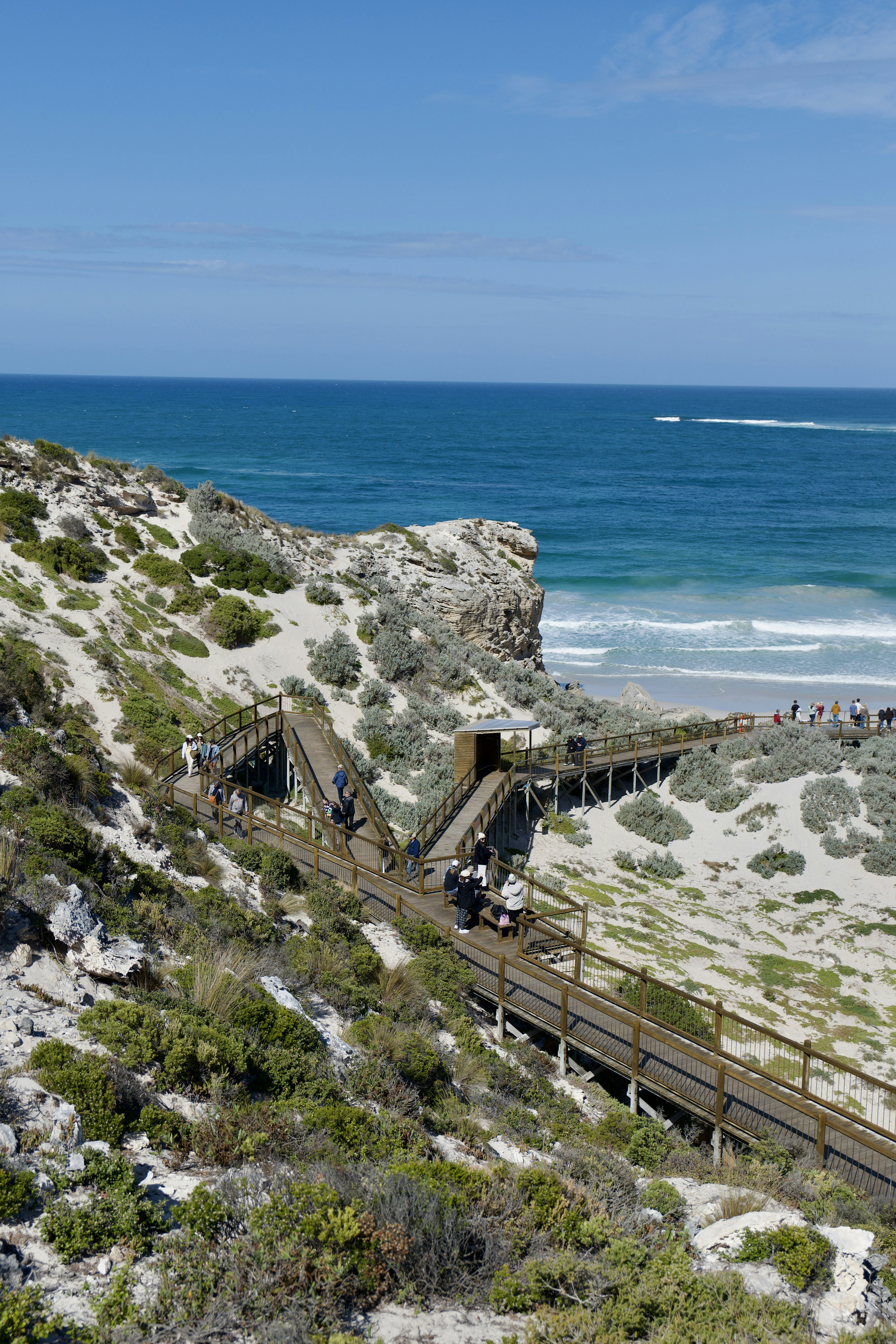 Coastal Staircase: People Trek the Weathered Path to the Sea