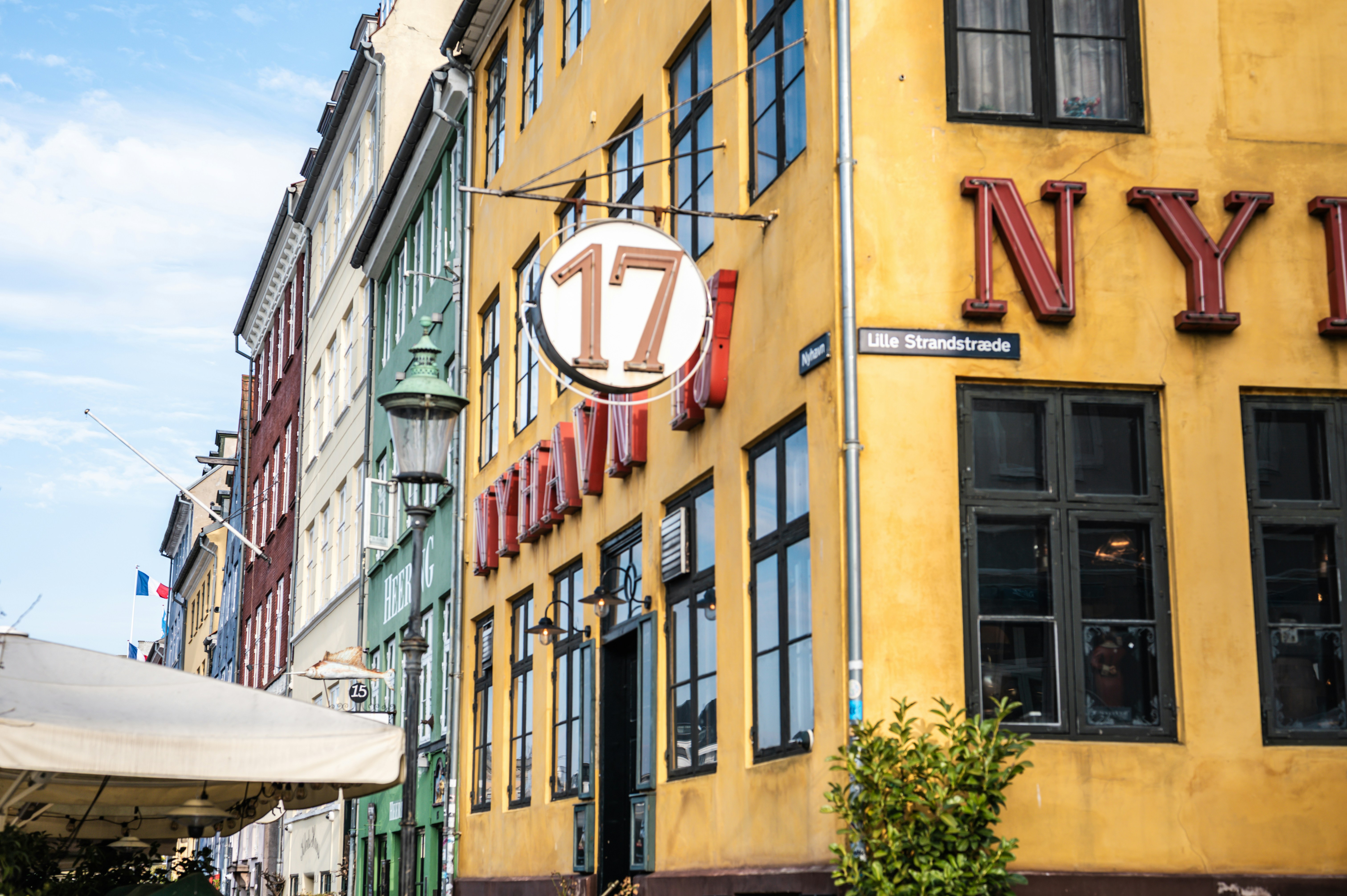 Colorful Nordic Facade and Pediment Sign in a Copenhagen–style Street