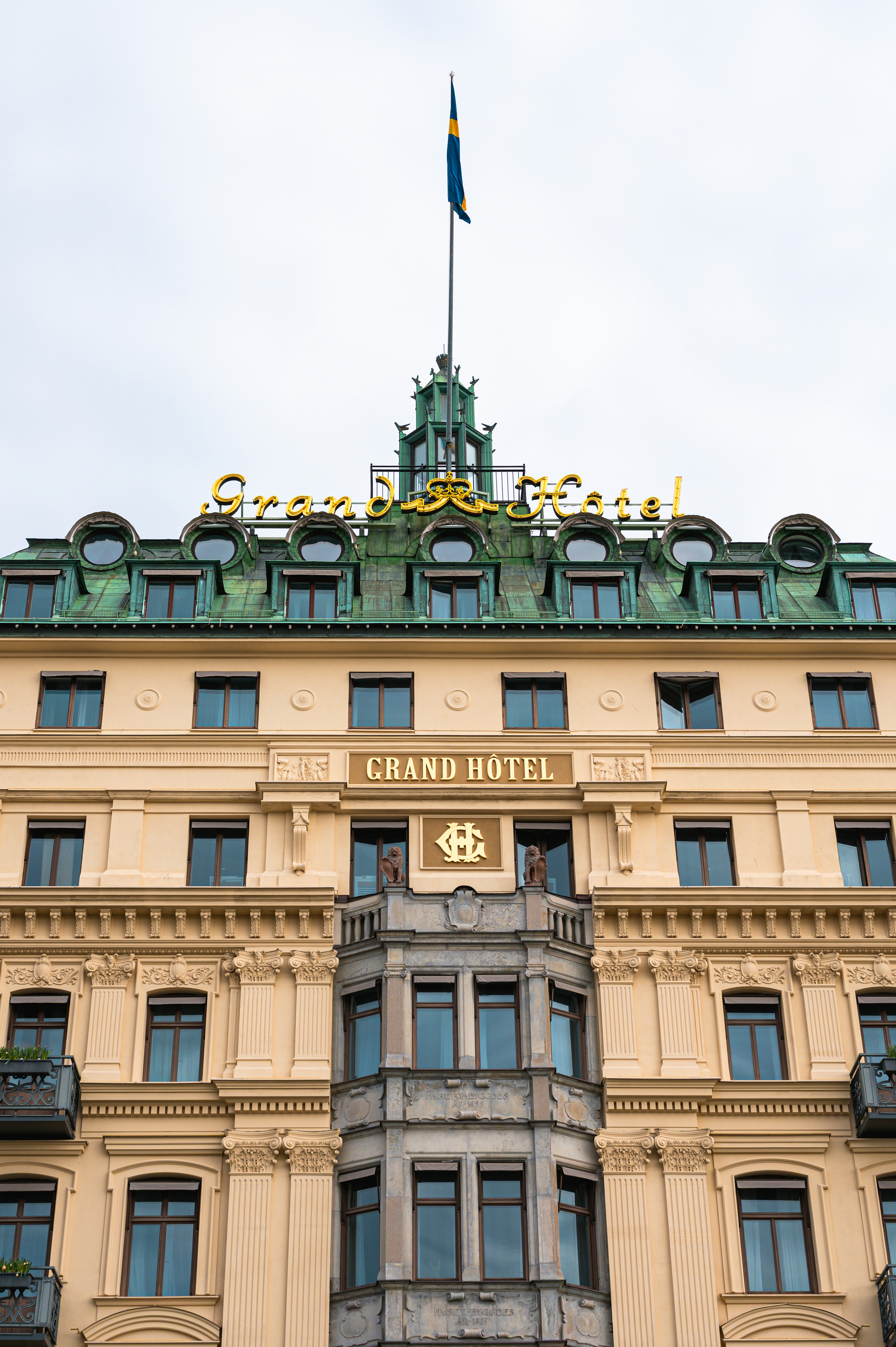 Grand Hotel Façade in pastel tones with gilded signage