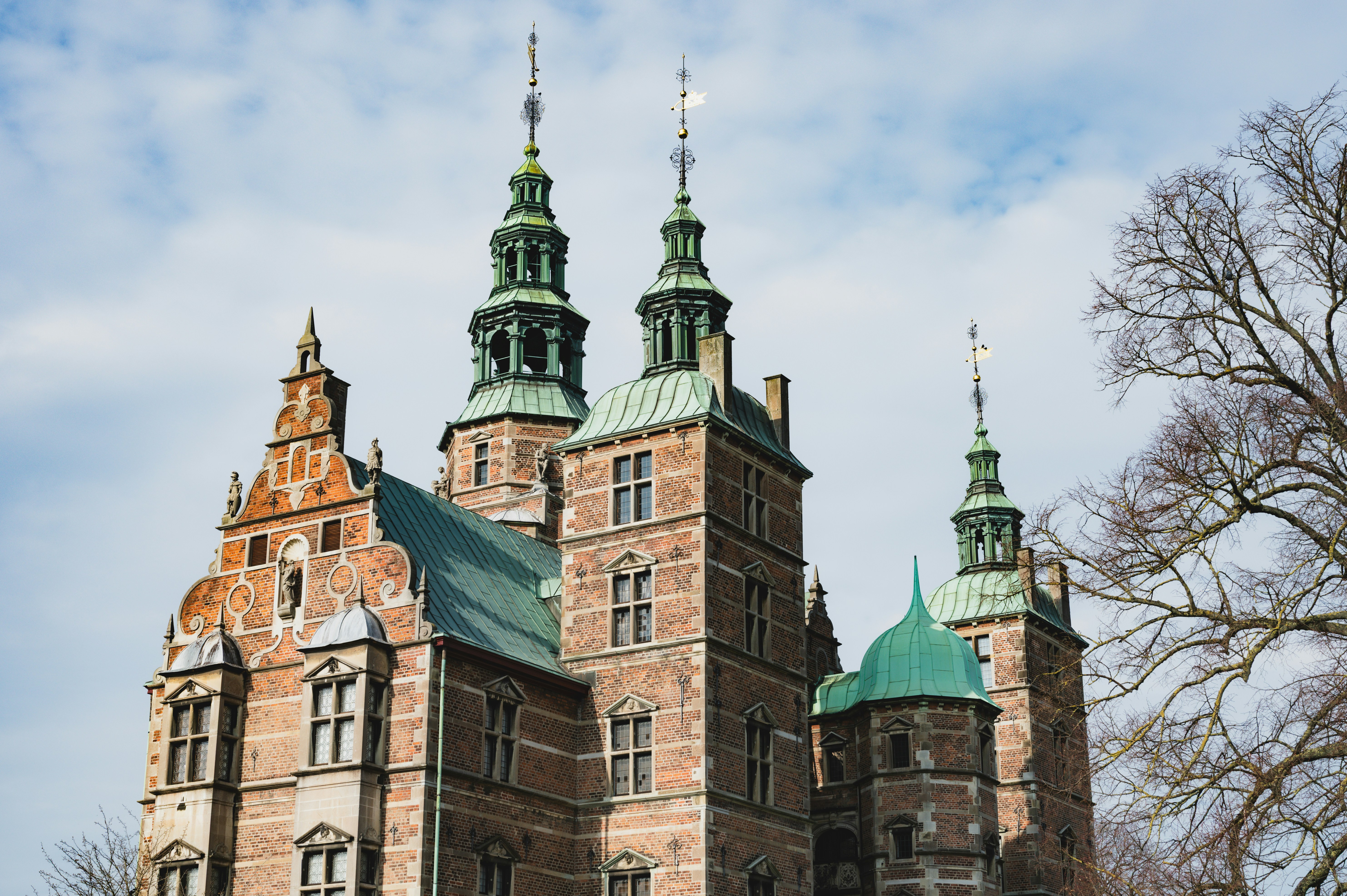 Majestic Turrets: A Nordic Castle Crowned in Copper and Sky