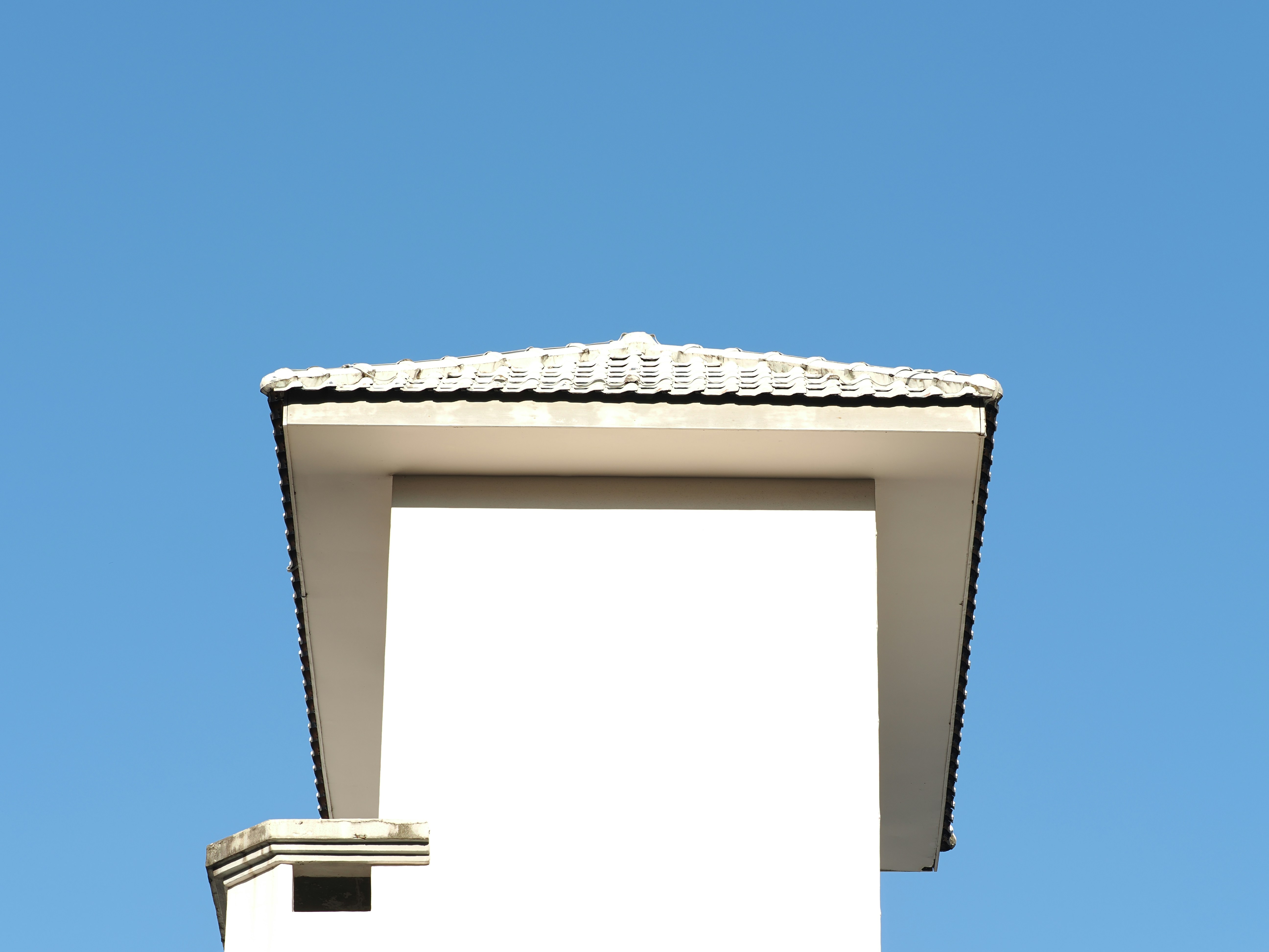 Minimalist rooftop with clear blue sky