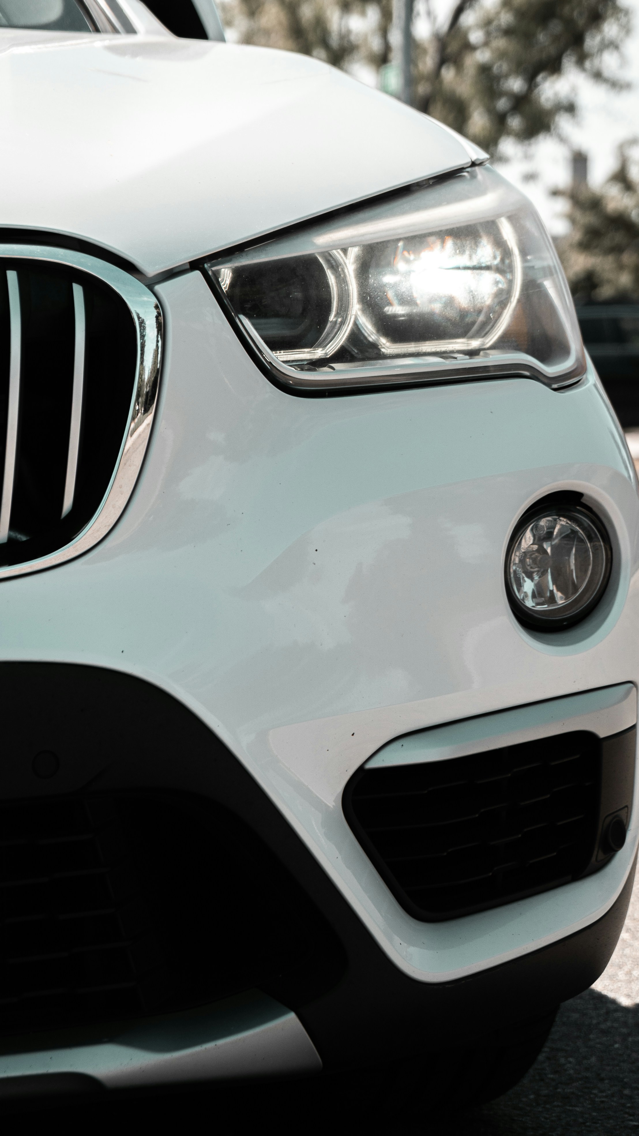 Close-Up of a Modern Headlight Grille: Automotive Facade in Focus