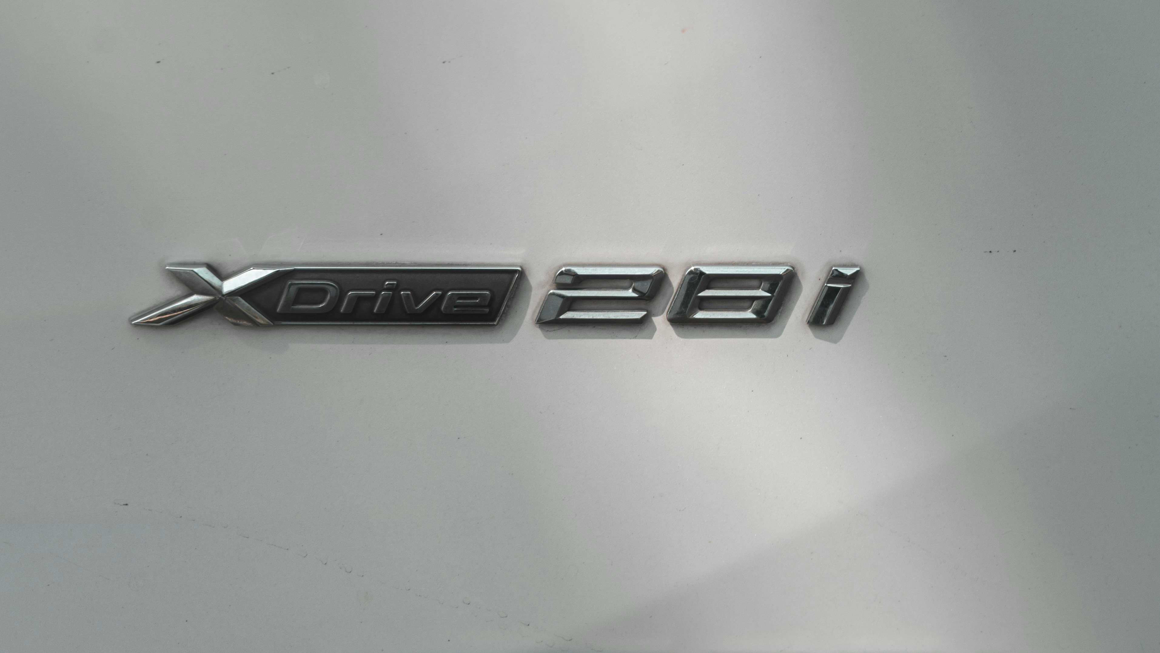 Shiny XDrive 281 Emblem on a Metallic Surface