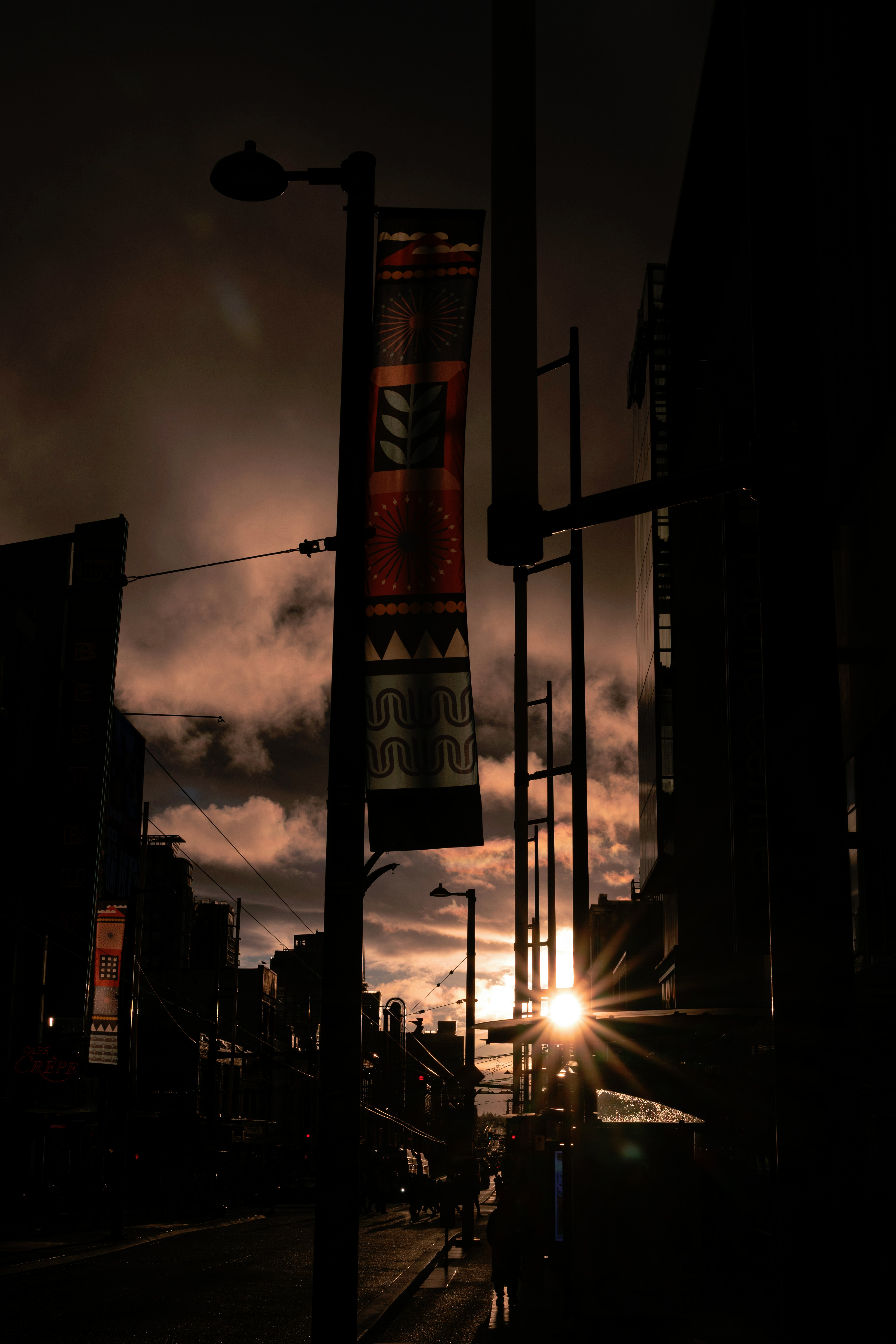Sunburst Through the Urban Corridor at Dusk
