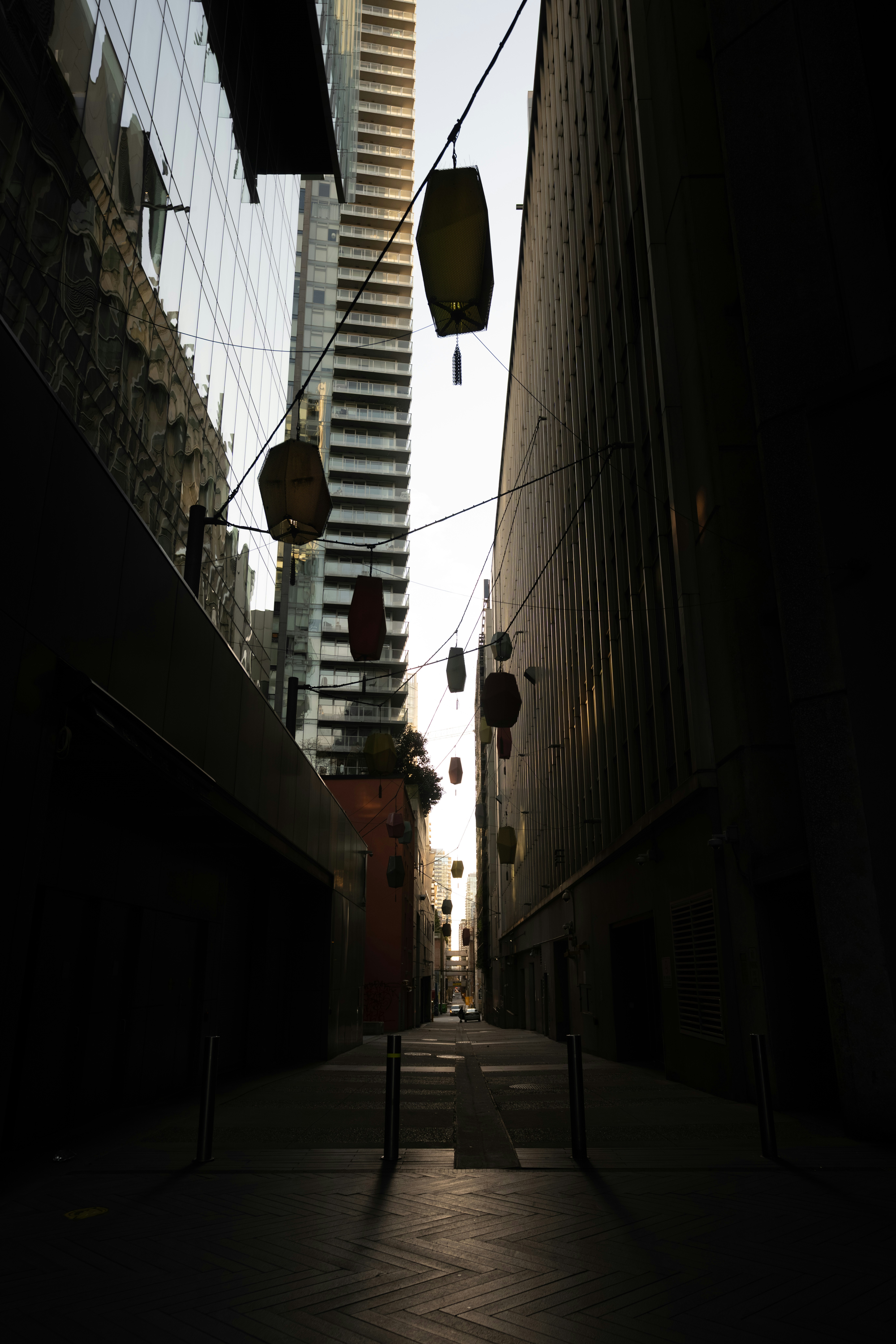 Lanterns Descend the Alley: A Vertical Slice of Urban Twilight