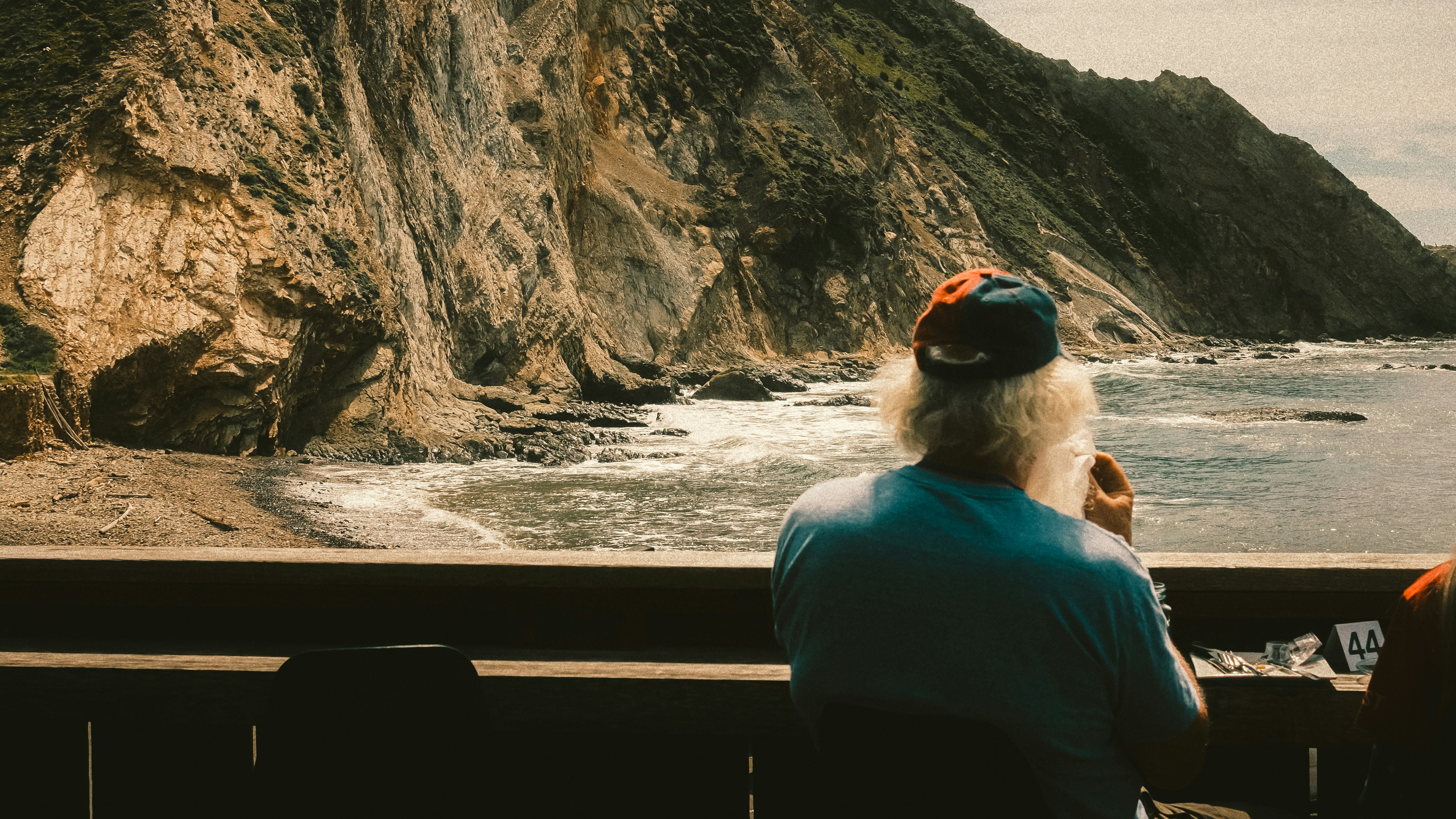 Watching the Quiet Edge: A Photographer at the Cliffside Rail