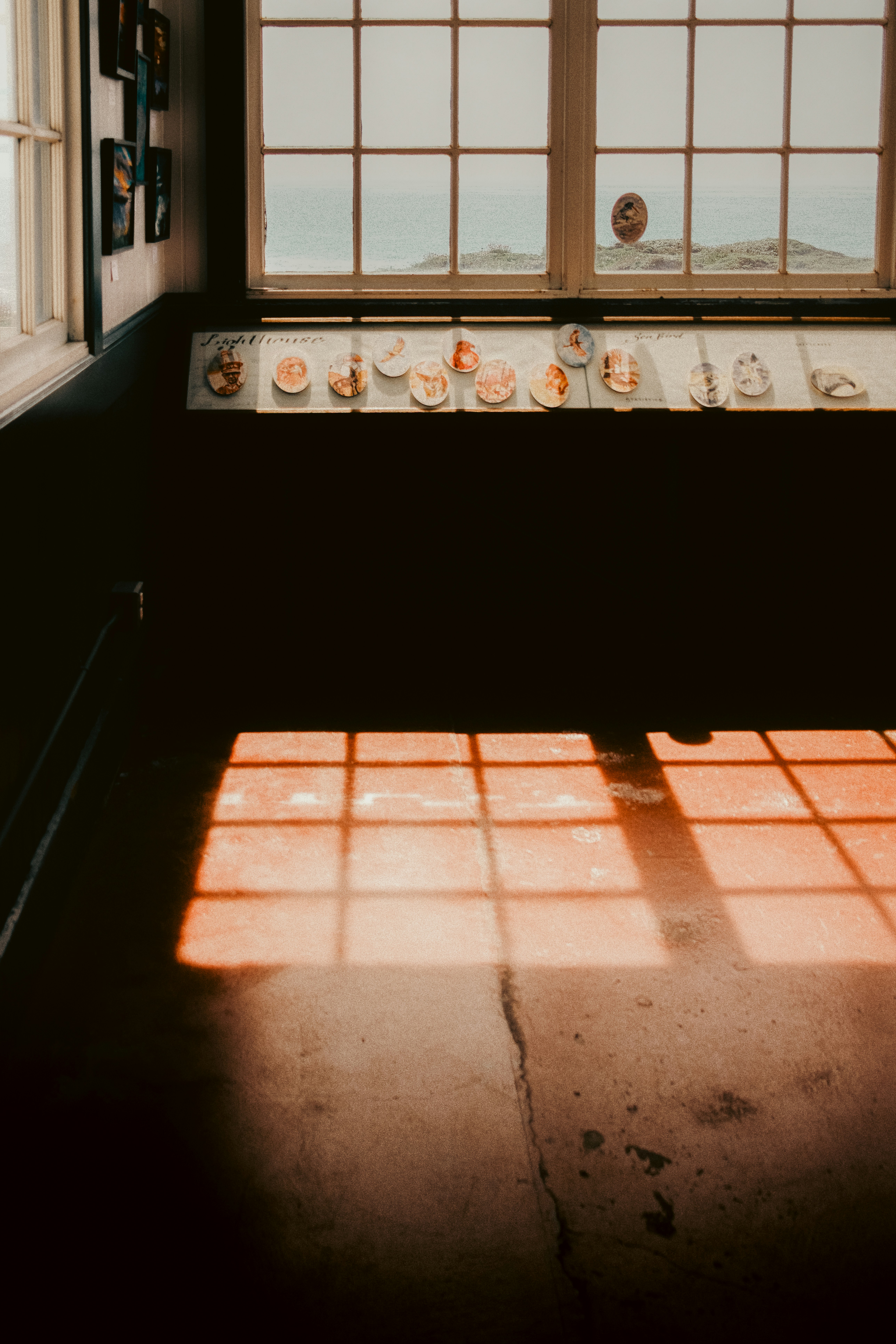 Sunlit Window Bench: Sea Light and Shadow in a Quiet Corner