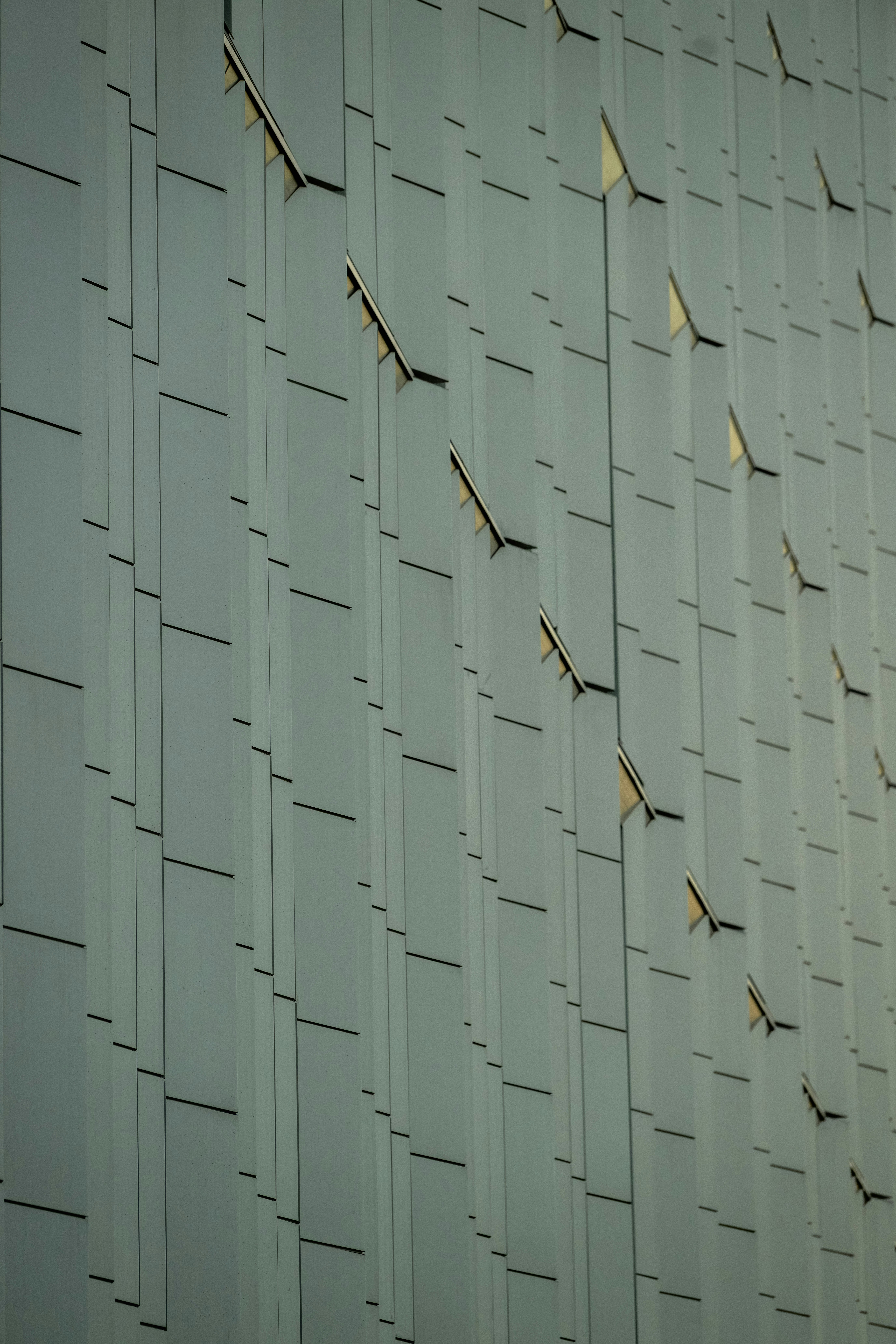 Geometric Facade: Repeating Slats in Muted Green