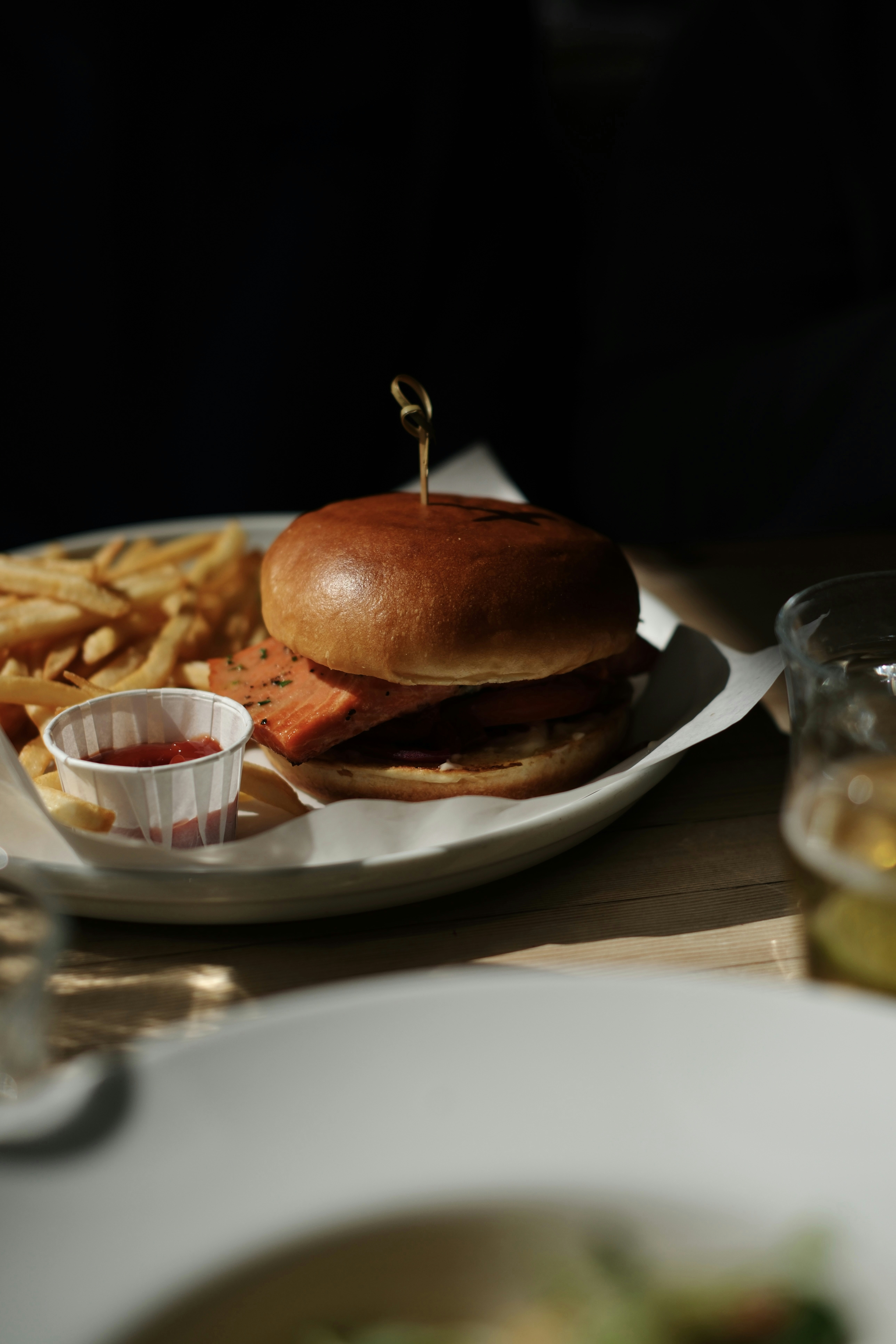 Golden Buns on a Plate: A Close-Up of a Savory Burger Duo