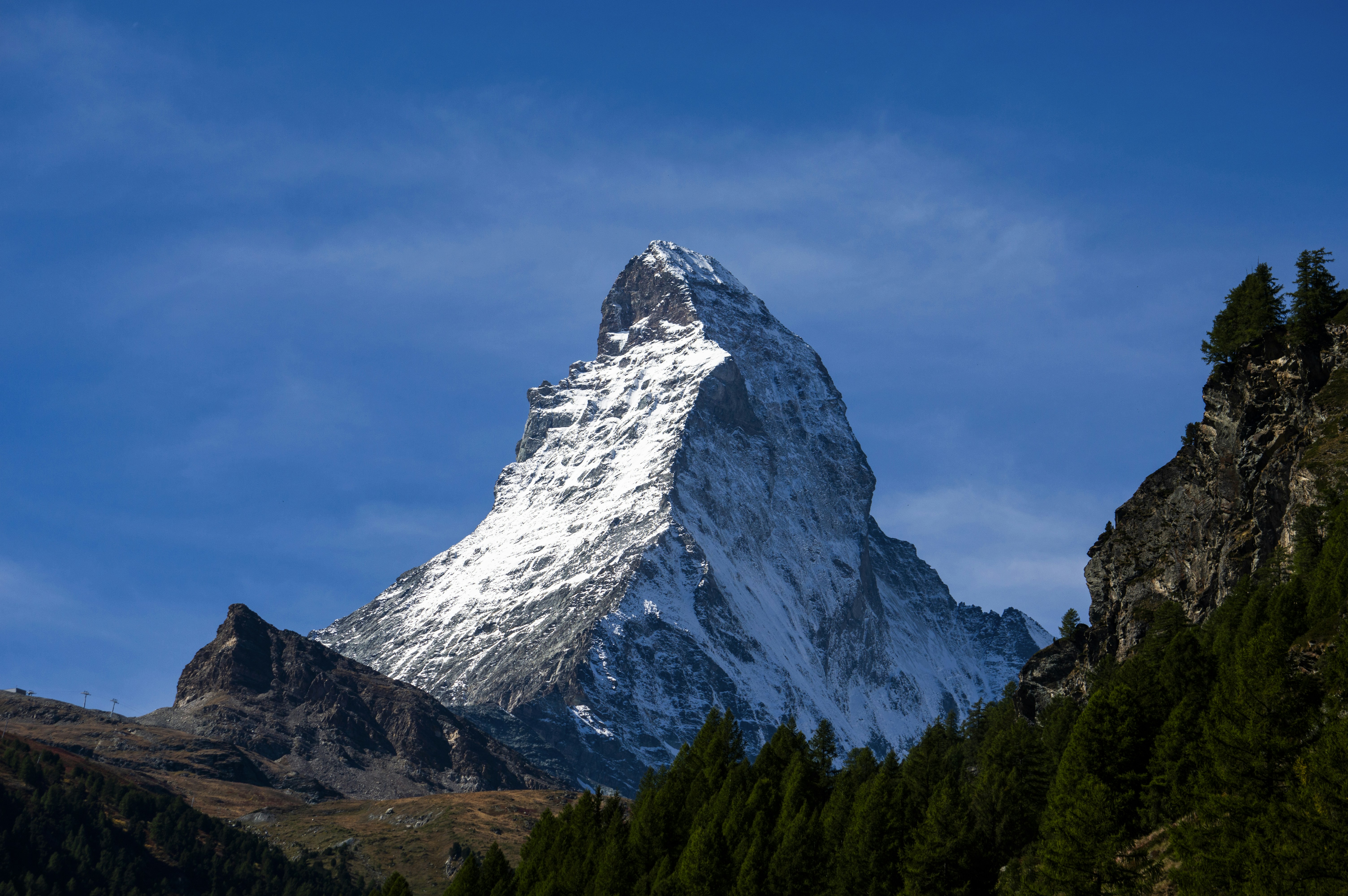 Icy Apex: The Sharp Peak Pierces a Clear Alpine Sky