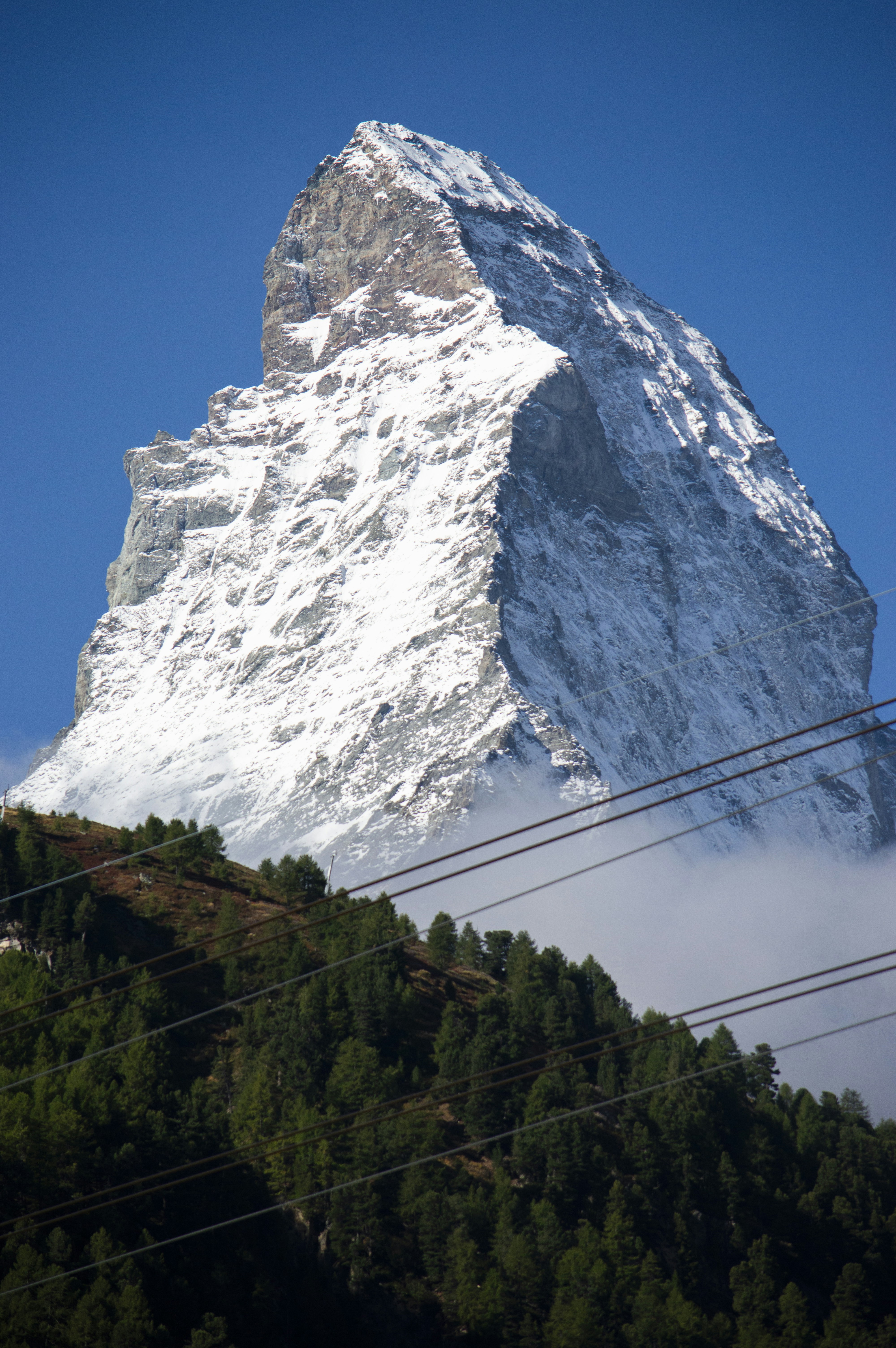 Peak Piercing the Sky: Snow-Capped Matterhorn Under Clear Blue