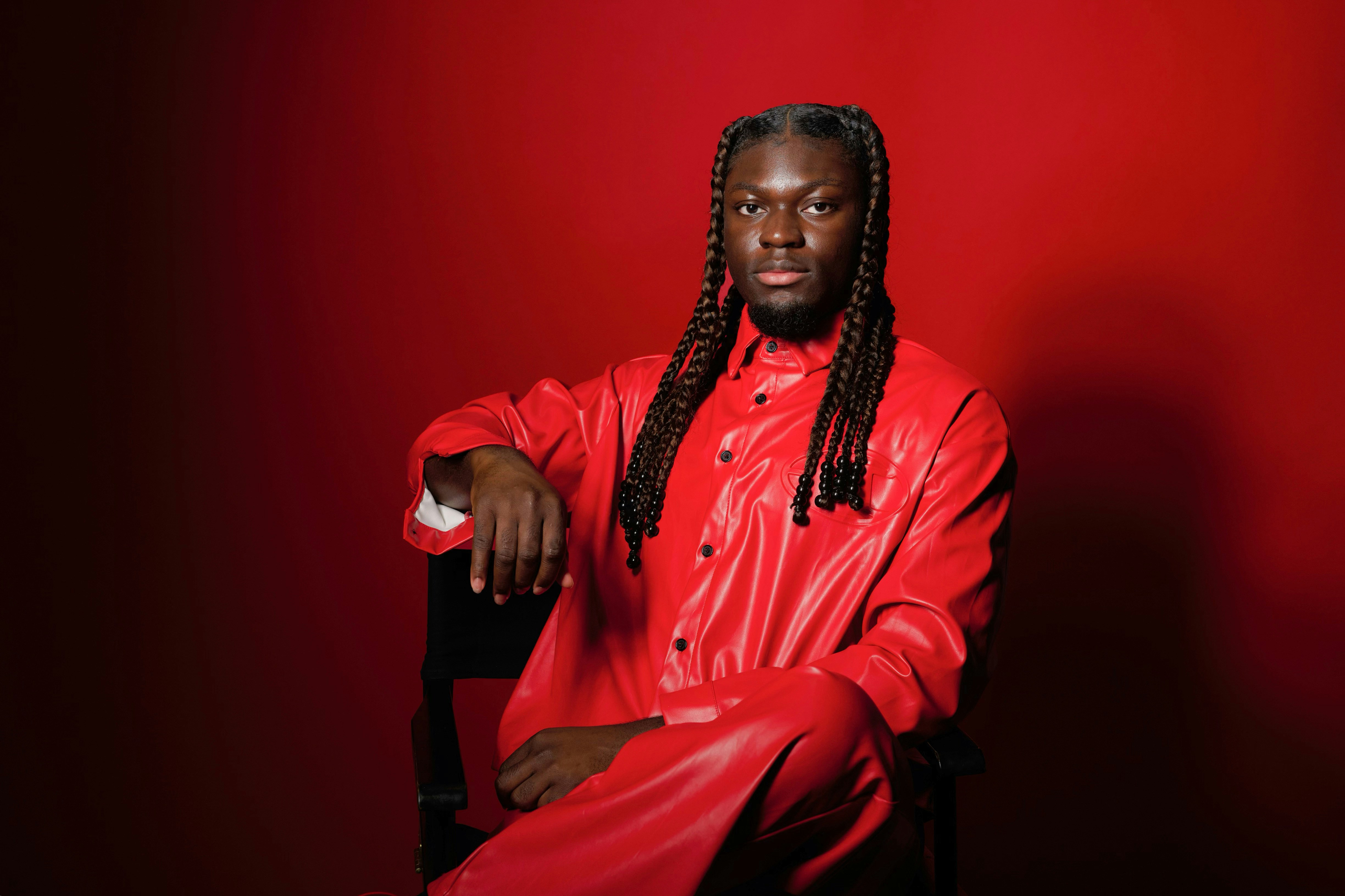 Red Attitude: A Confident Portrait in Bright Vinyl