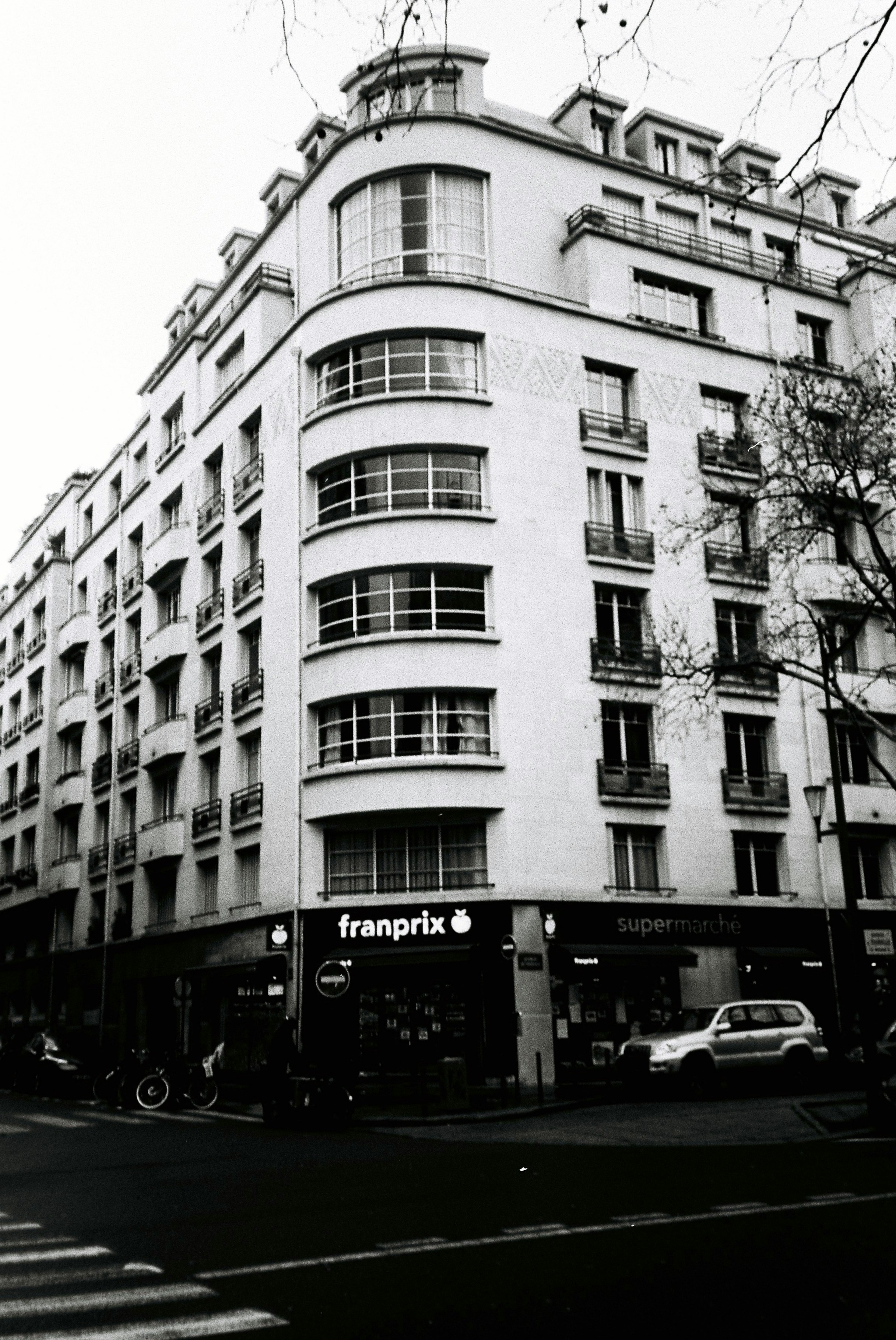 Cornered in Paris: A Monolithic Facade and Ground-Level Life