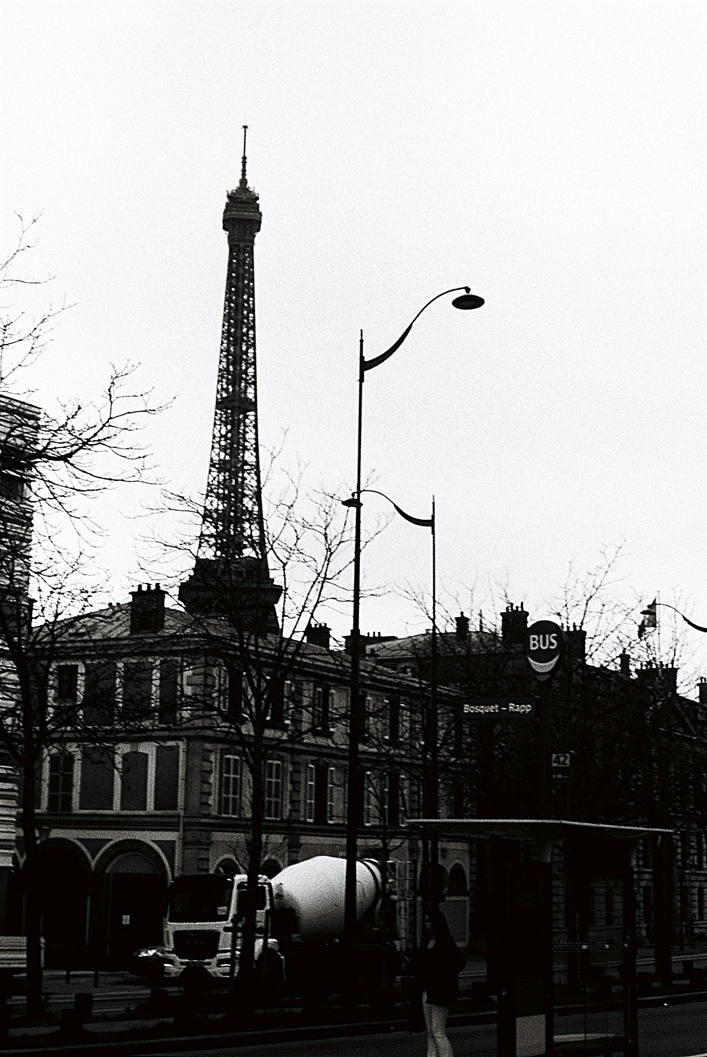 Paris Skyline in Grain: Eiffel Tower Silhouette over a Quiet Street