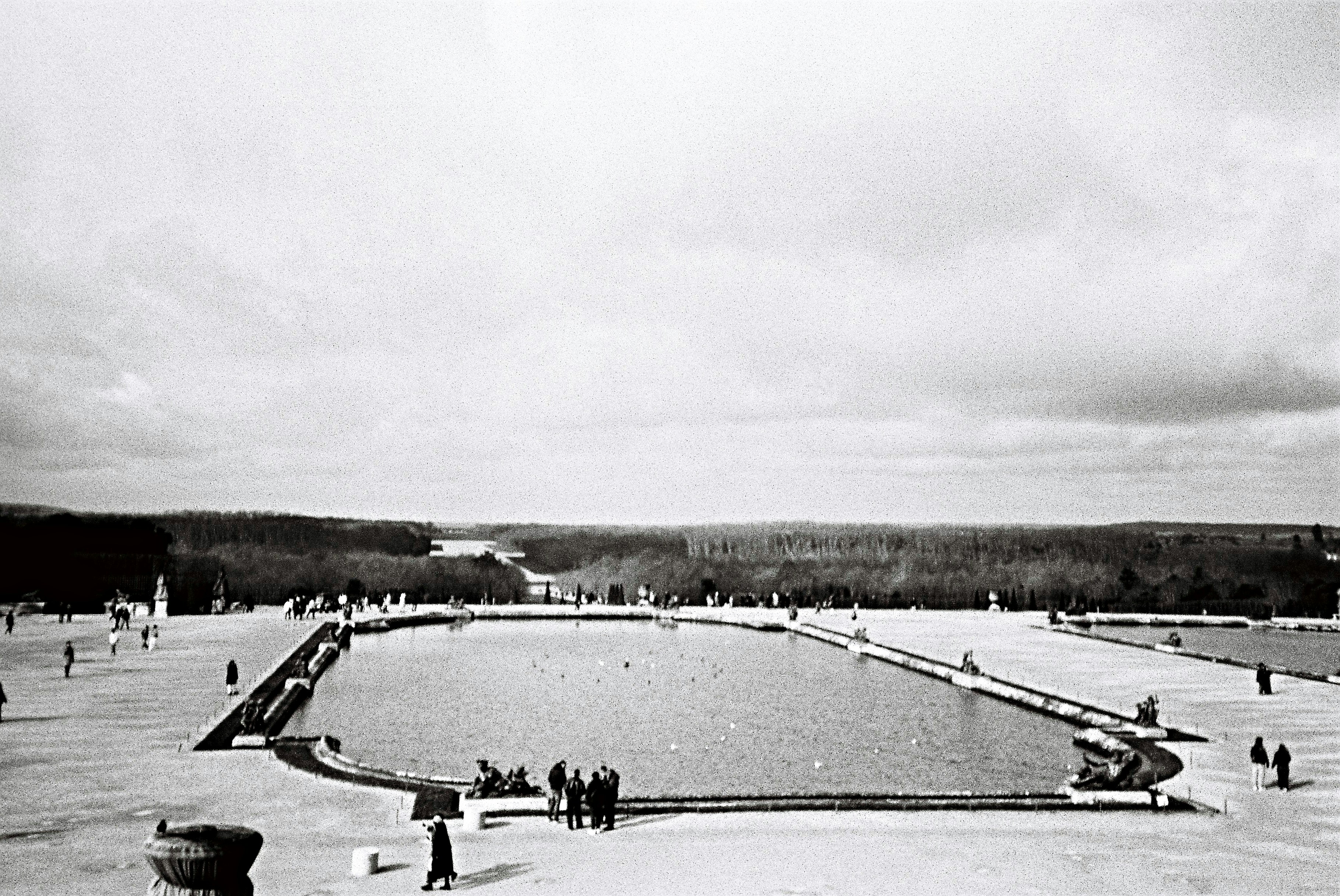 Echoes Across the Circular Basin: A Panoramic Terrace Under an Overcast Sky