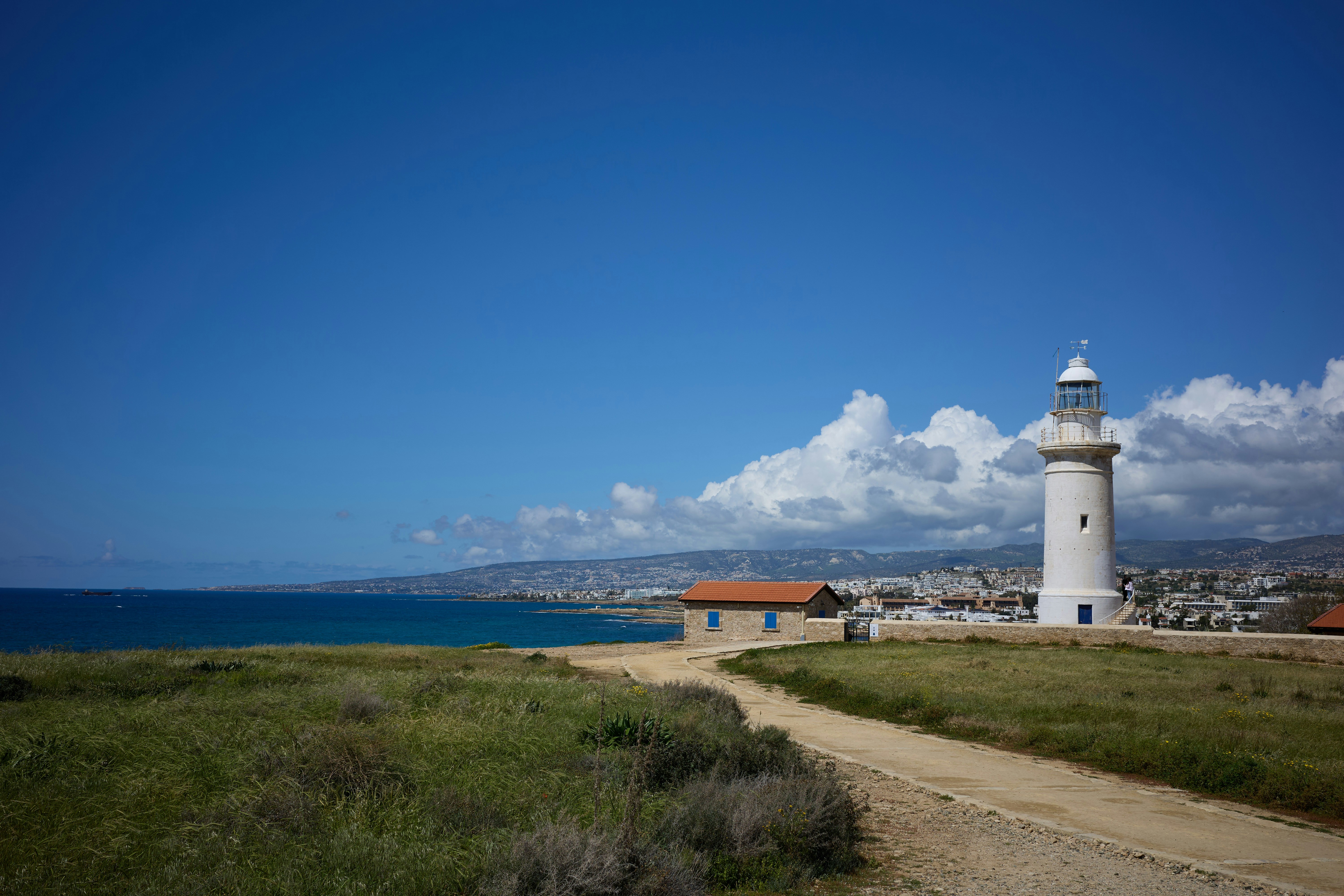 Coastal Sentinel: A Lone Lighthouse Overlooking the Calm Atlantic