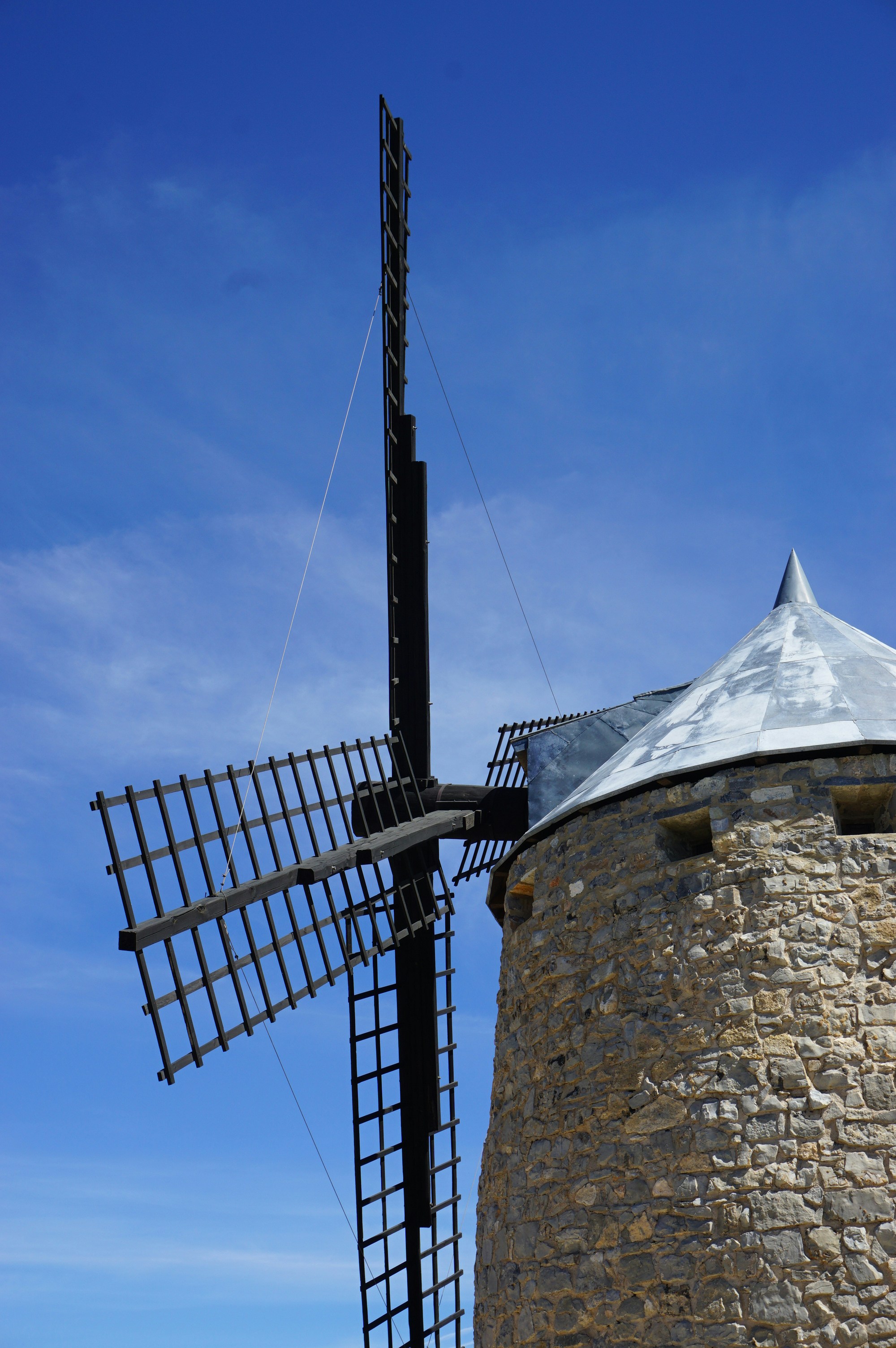 Stone Windmill against a Clear Blue Sky