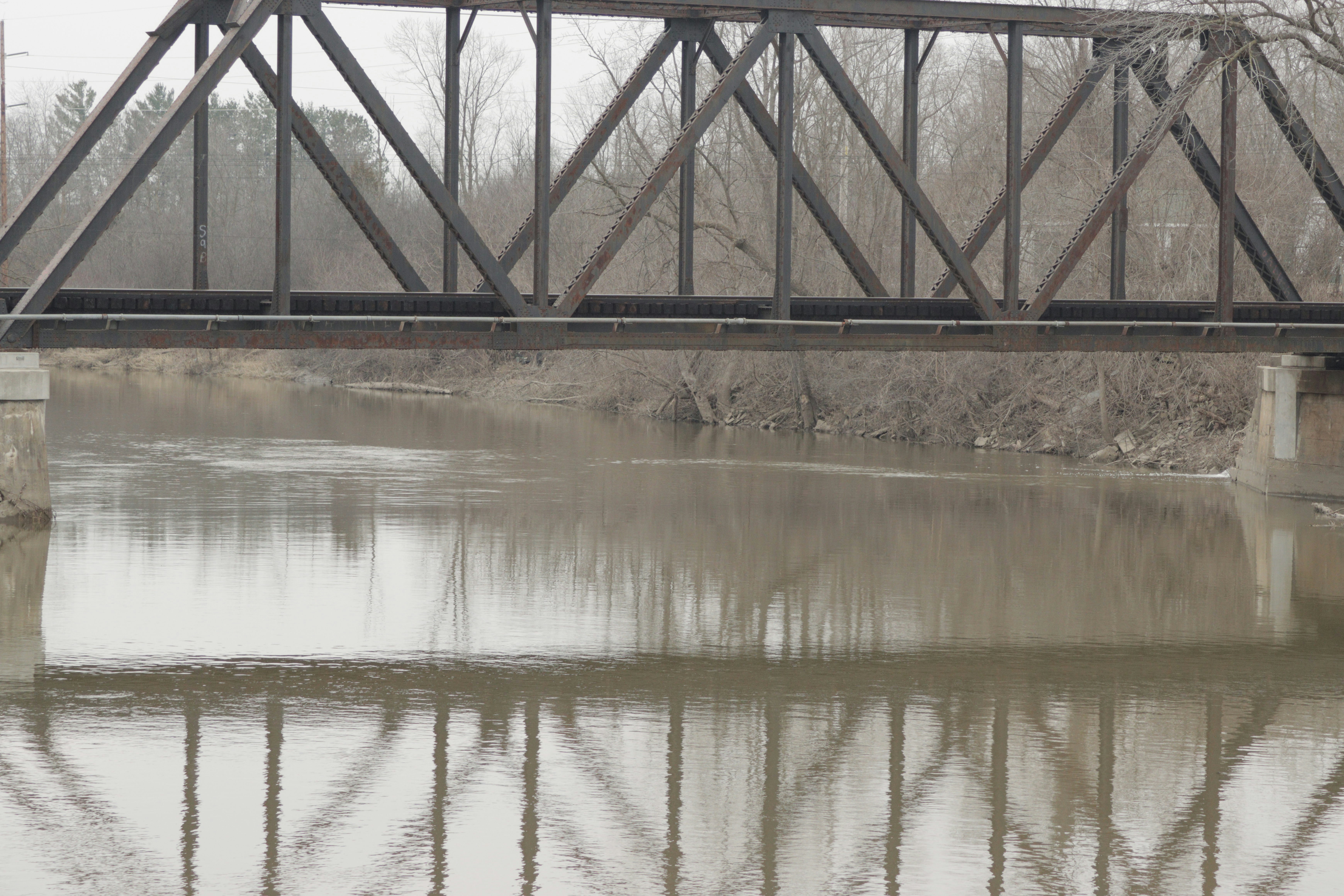 Industrial Truss and River Reflection