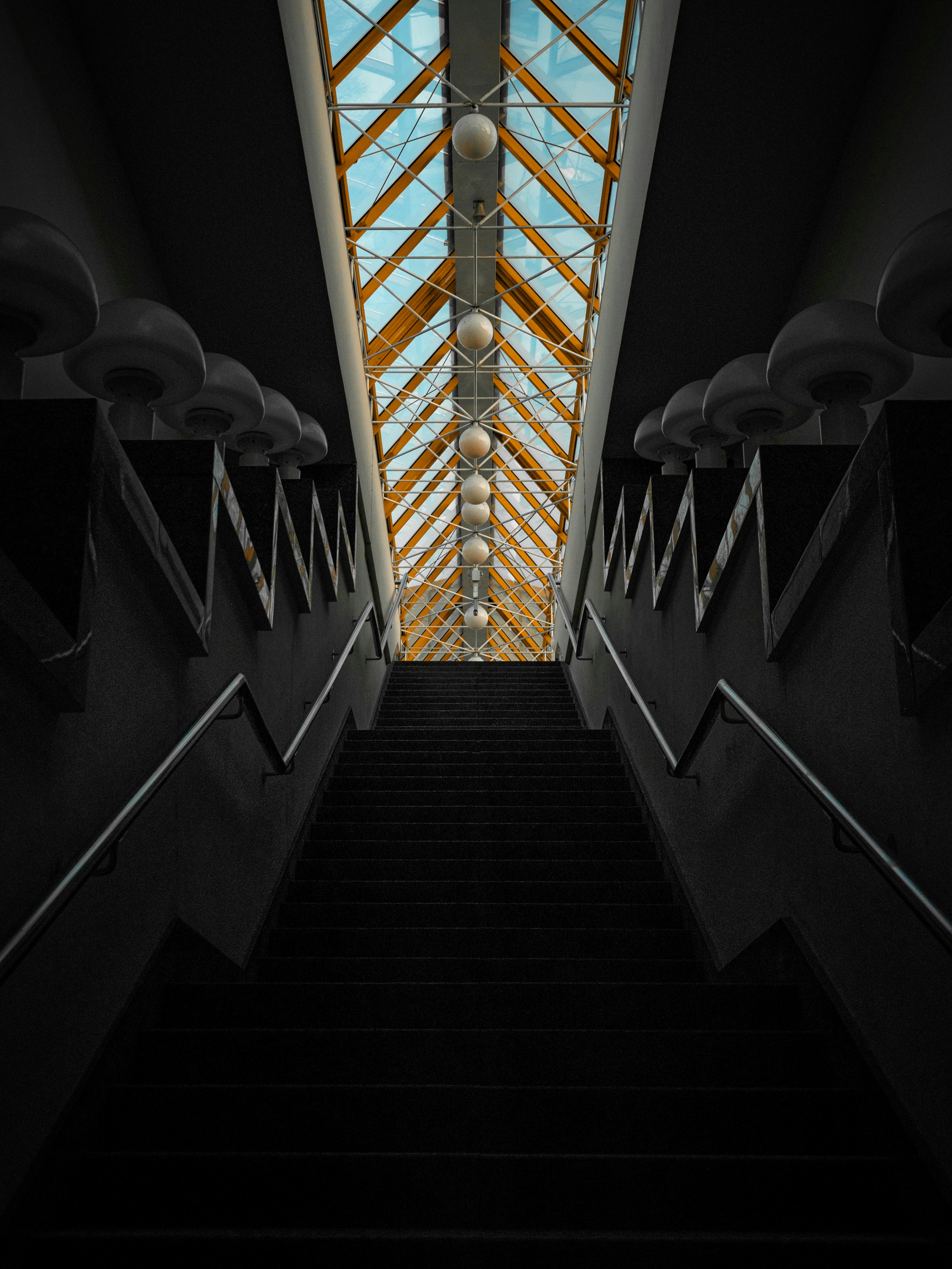 Vertical Ascent: A Symmetry of Light and Shadows in an Architectural Stairwell